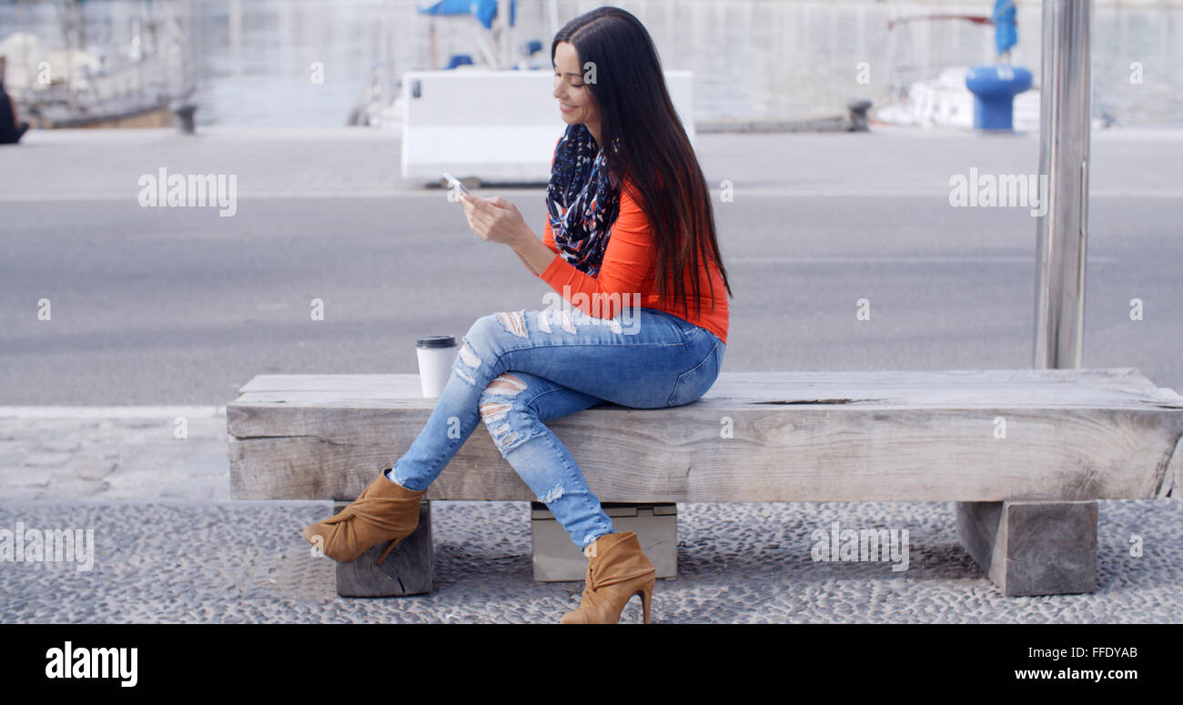 Relaxed confident young woman on a mobile Stock Photo - Alamy