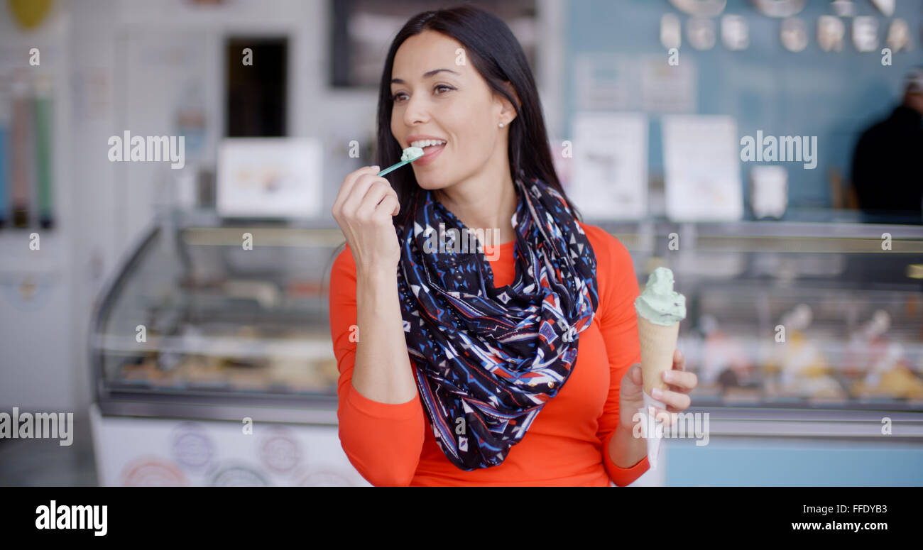 Attractive stylish young woman in a delicatessen Stock Photo - Alamy
