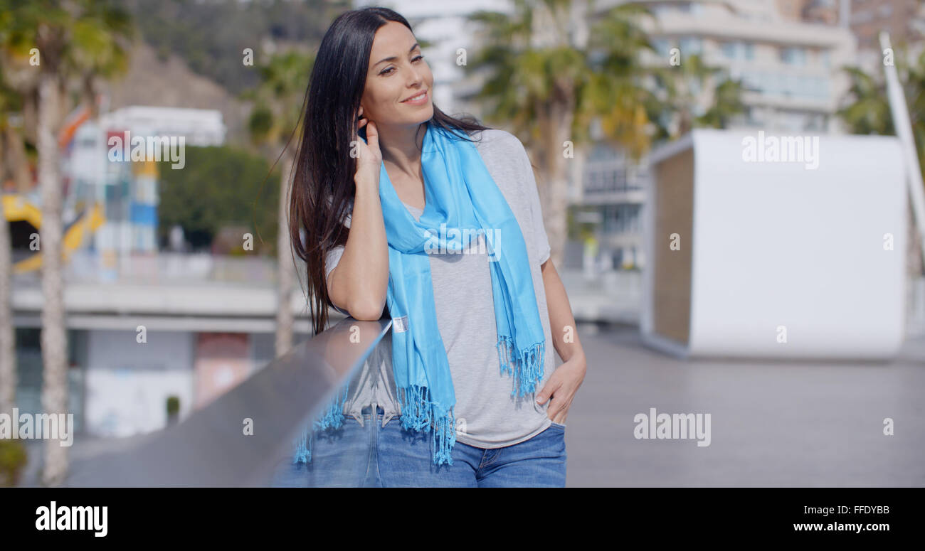 Gorgeous woman putting hand through hair Stock Photo - Alamy