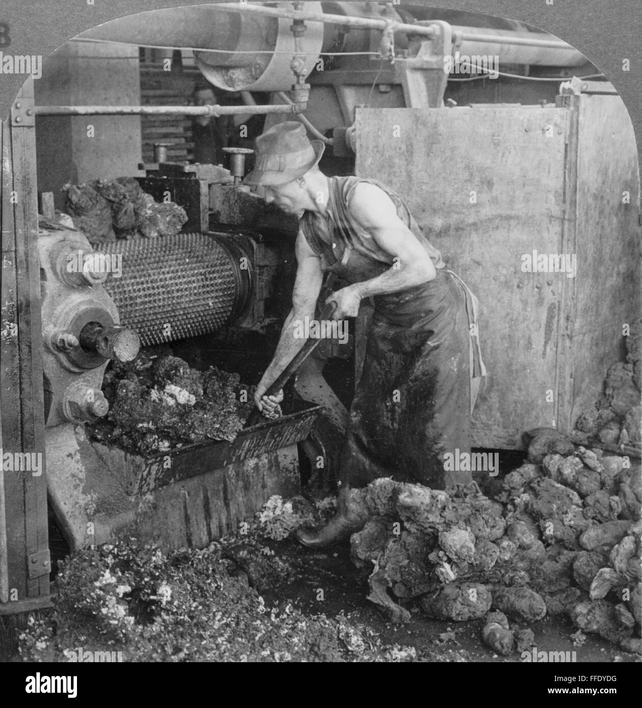 RUBBER PRODUCTION, c1928. /nCrude rubber from Brazil being cracked by a ...