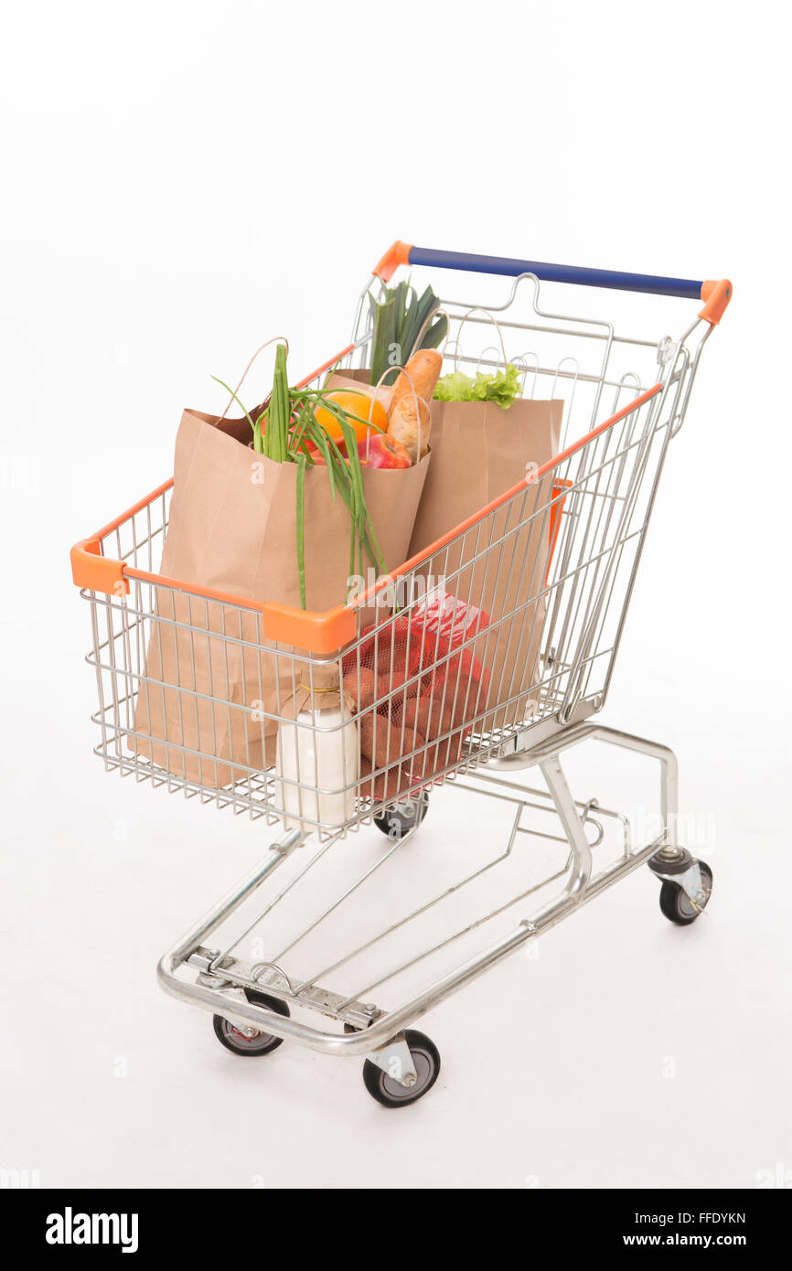 Shopping cart with shopping bags Stock Photo - Alamy