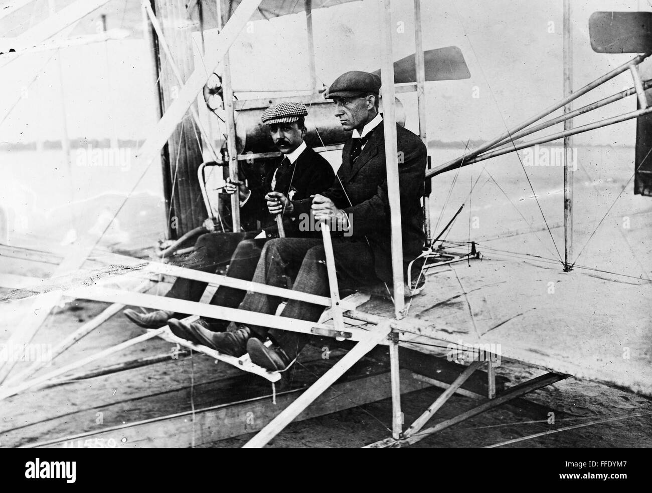 WILBUR WRIGHT (1867-1912)./nAmerican aviation pioneer. Wright sitting in his plane next to ...