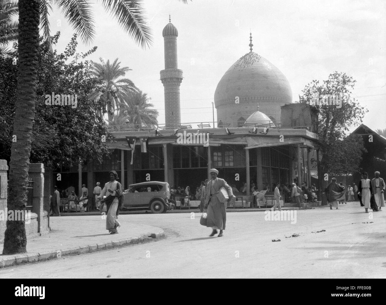IRAQ: STREET SCENE, 1932. /nA street and mosque in Iraq. Photograph ...