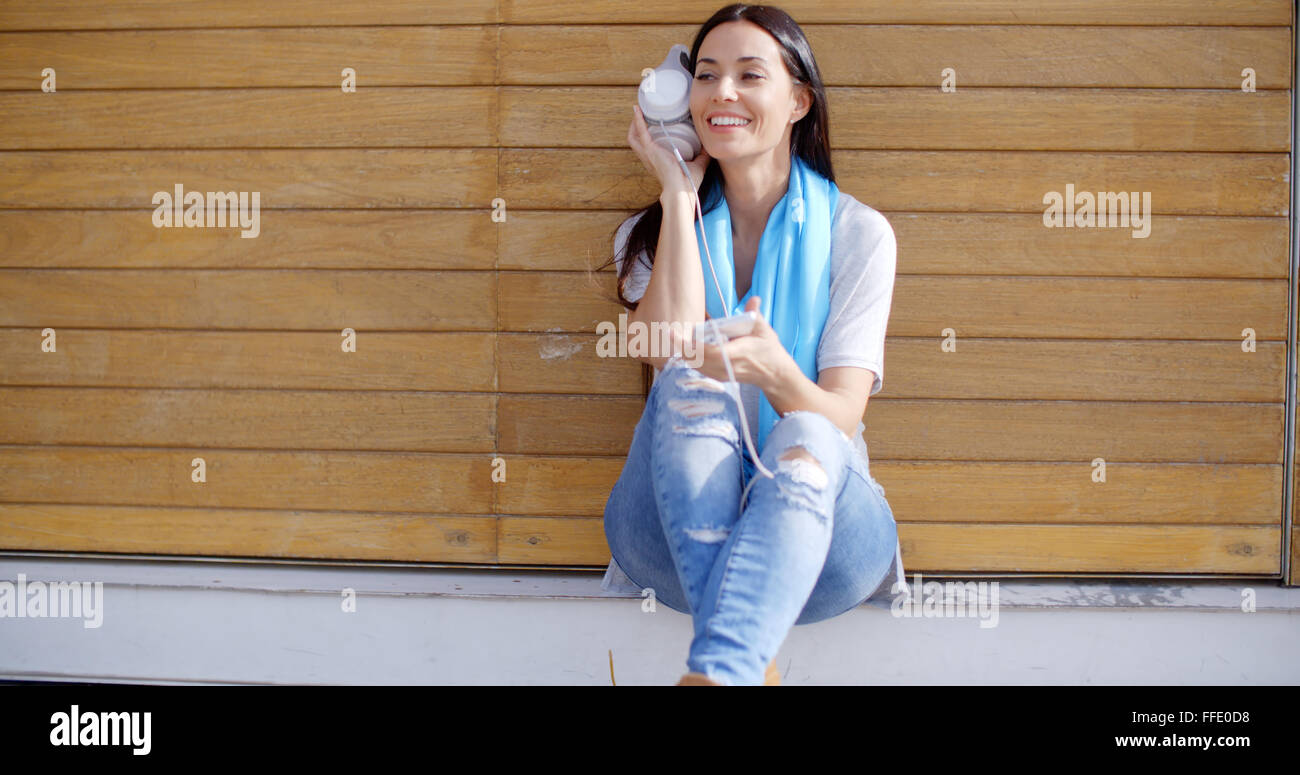 Happy relaxed young woman listening to music Stock Photo - Alamy