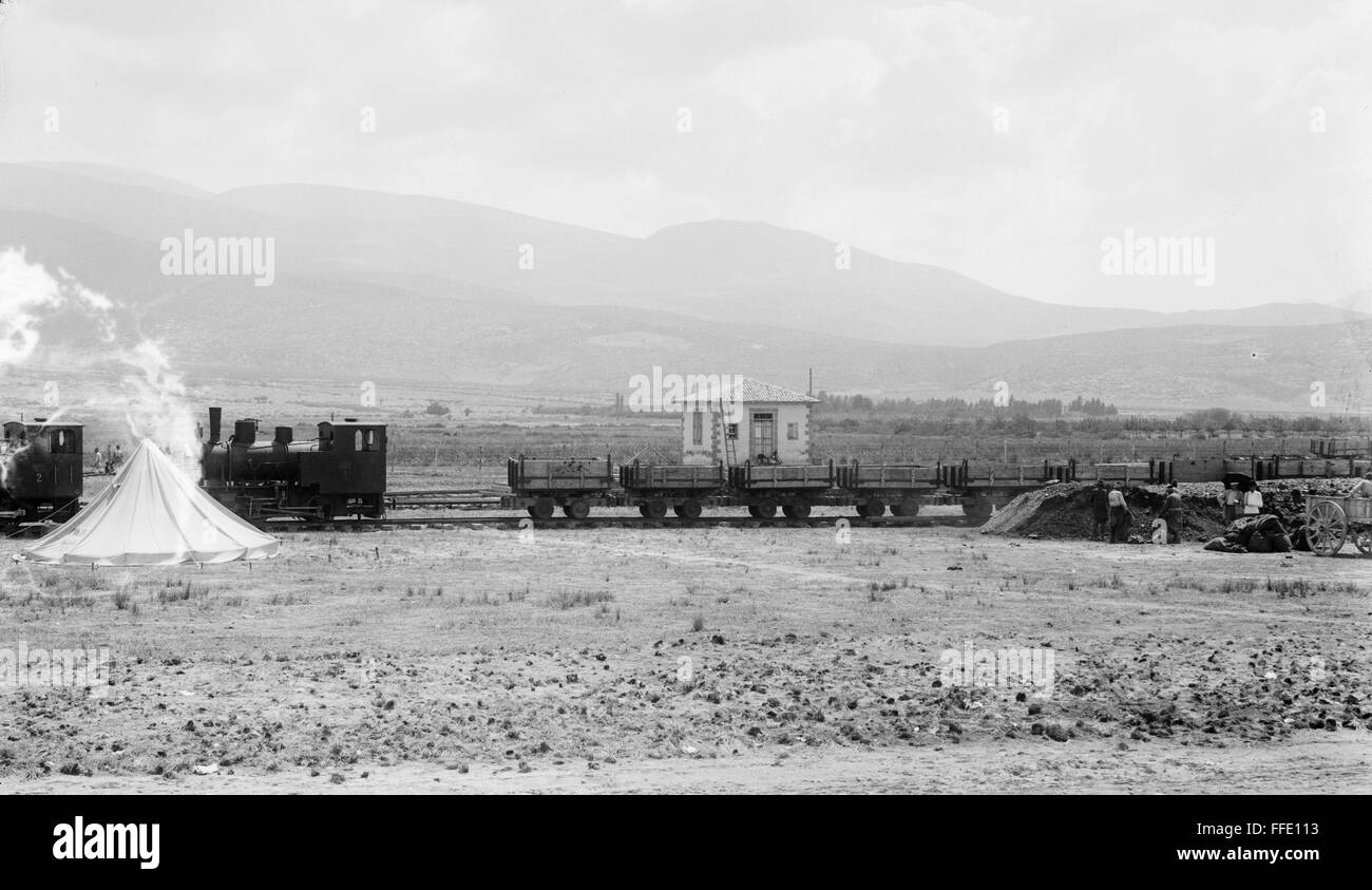 TURKEY: RAILROAD. /nTwo locomotives pulling open cars on the railraod ...
