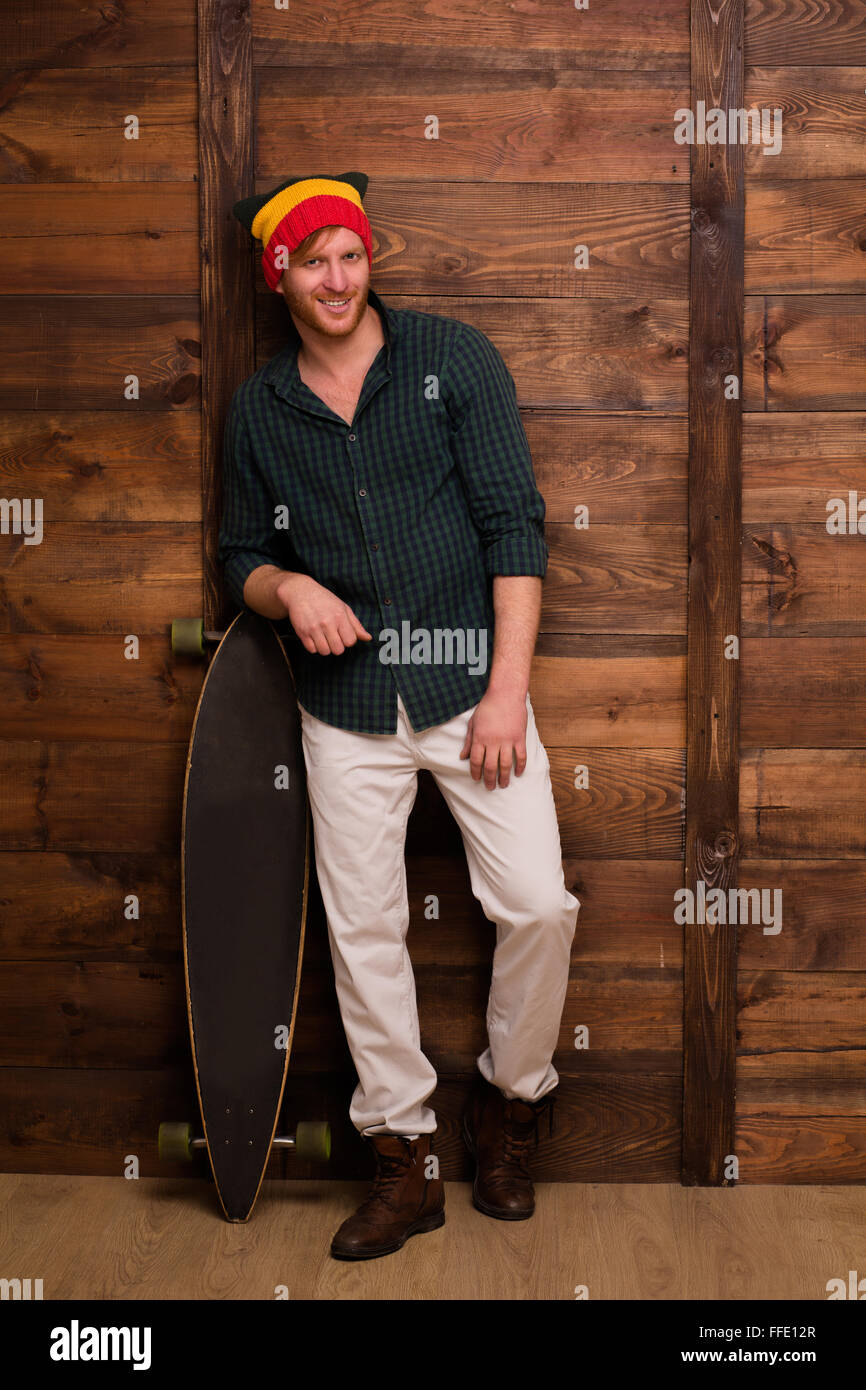 Hipster skateboarder in studio Stock Photo - Alamy