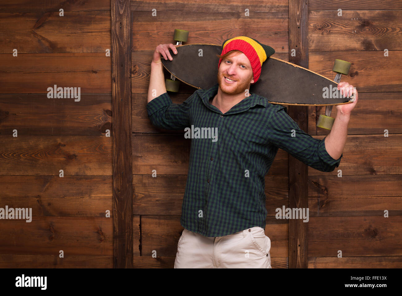 Hipster skateboarder in studio Stock Photo - Alamy