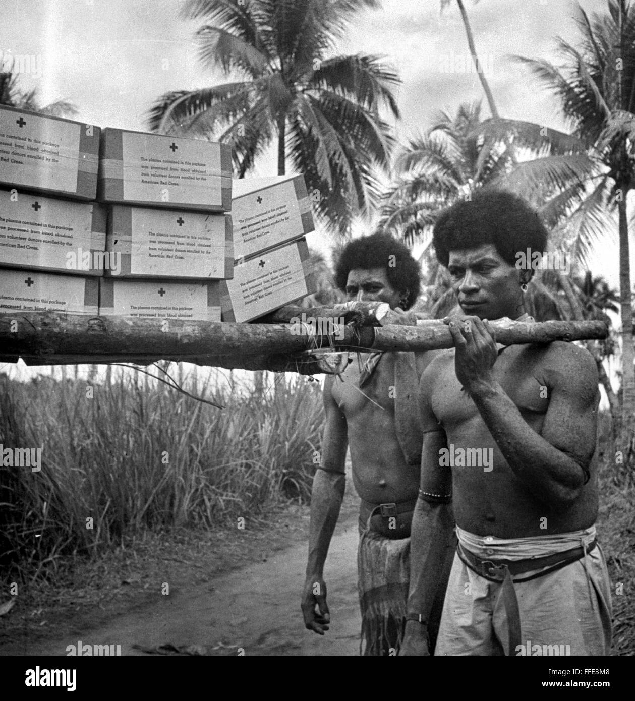 WORLD WAR II: NEW GUINEA. /nNatives of Papua New Guinea carrying blood ...