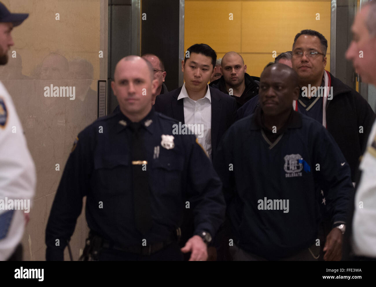 New York, NY, USA. 11th Feb, 2016. NYPD officer PETER LIANG, center ...