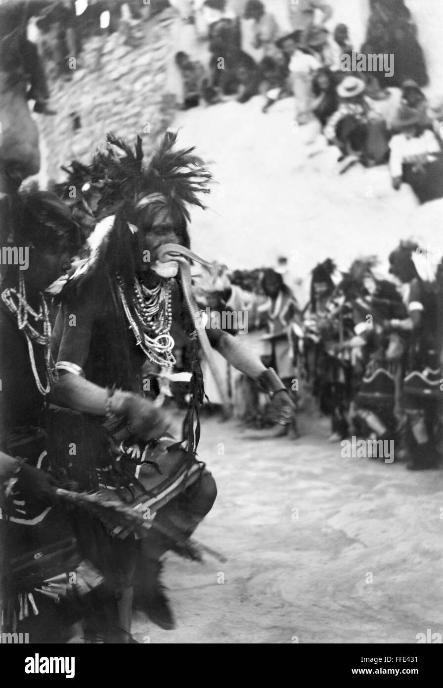HOPI SNAKE DANCE, c1899. /nA Hopi priest with a snake in his mouth ...