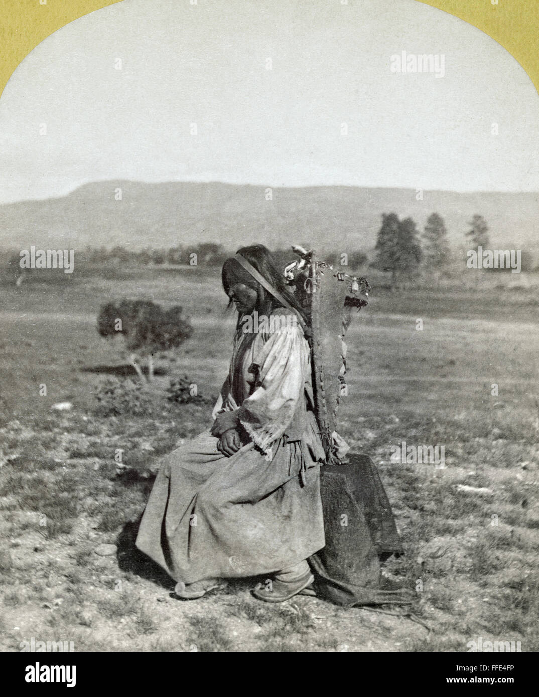 APACHE WOMAN, c1873. /nA Coyotero Apache woman carrying a baby in a ...