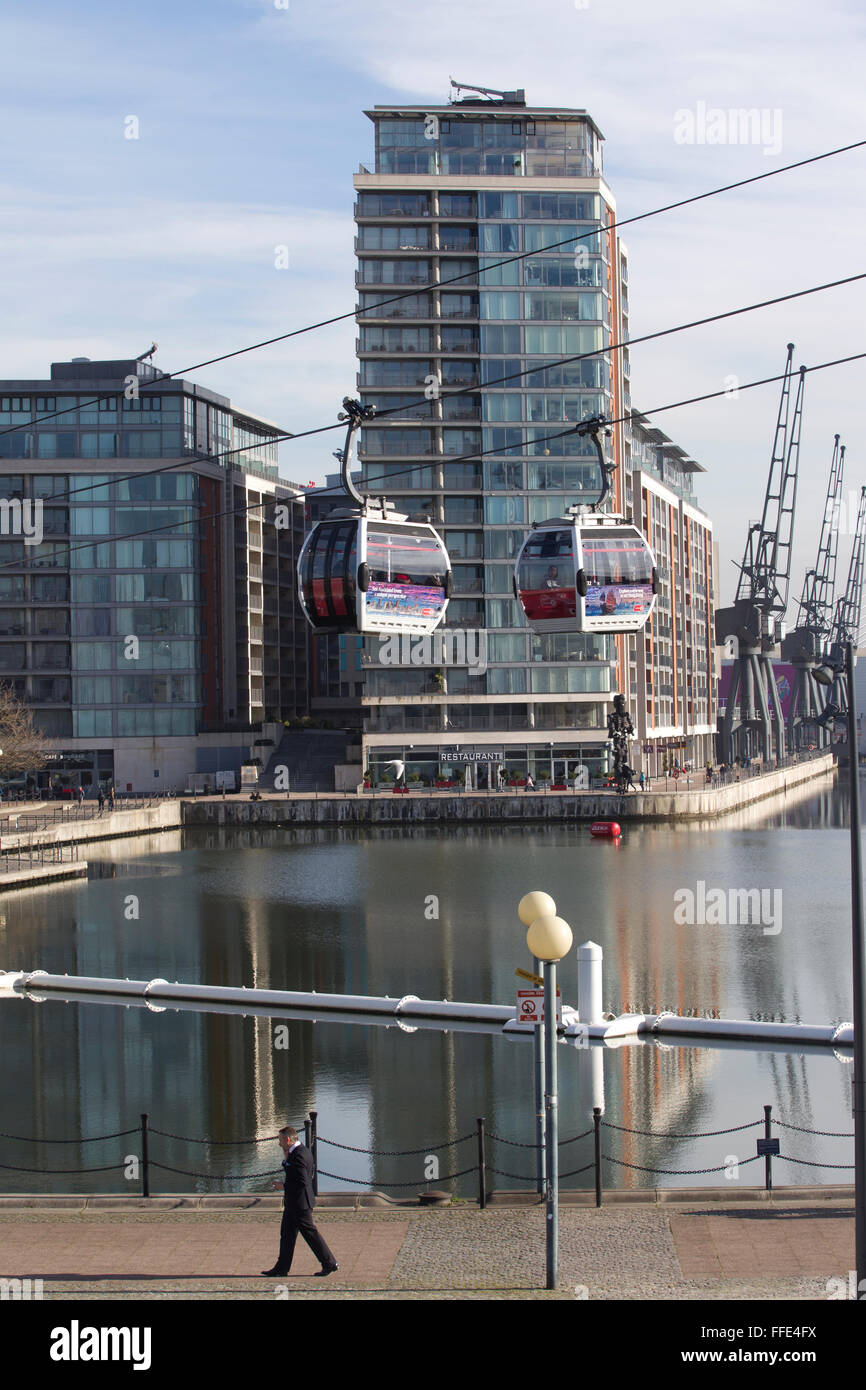 Emirates Air Line cable cars running across The Royal Victoria Dock ...