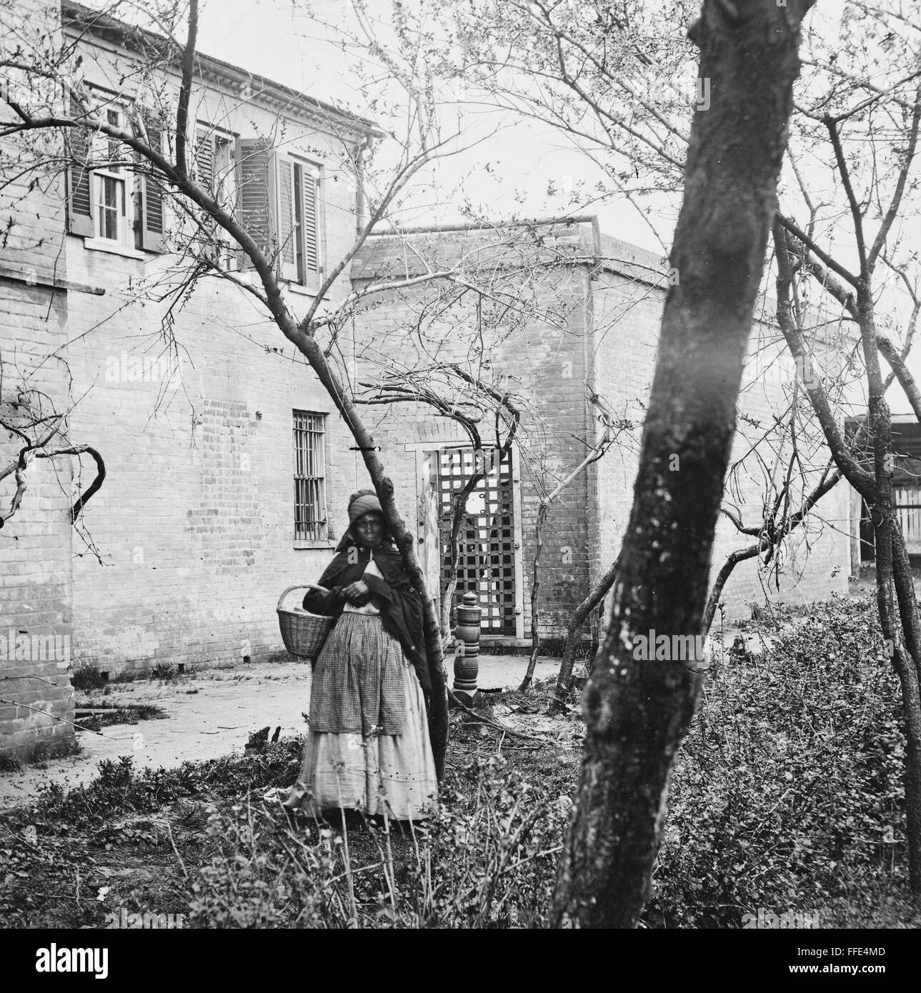 VIRGINIA: SLAVE PEN, c1861. /nAn African American woman standing in ...