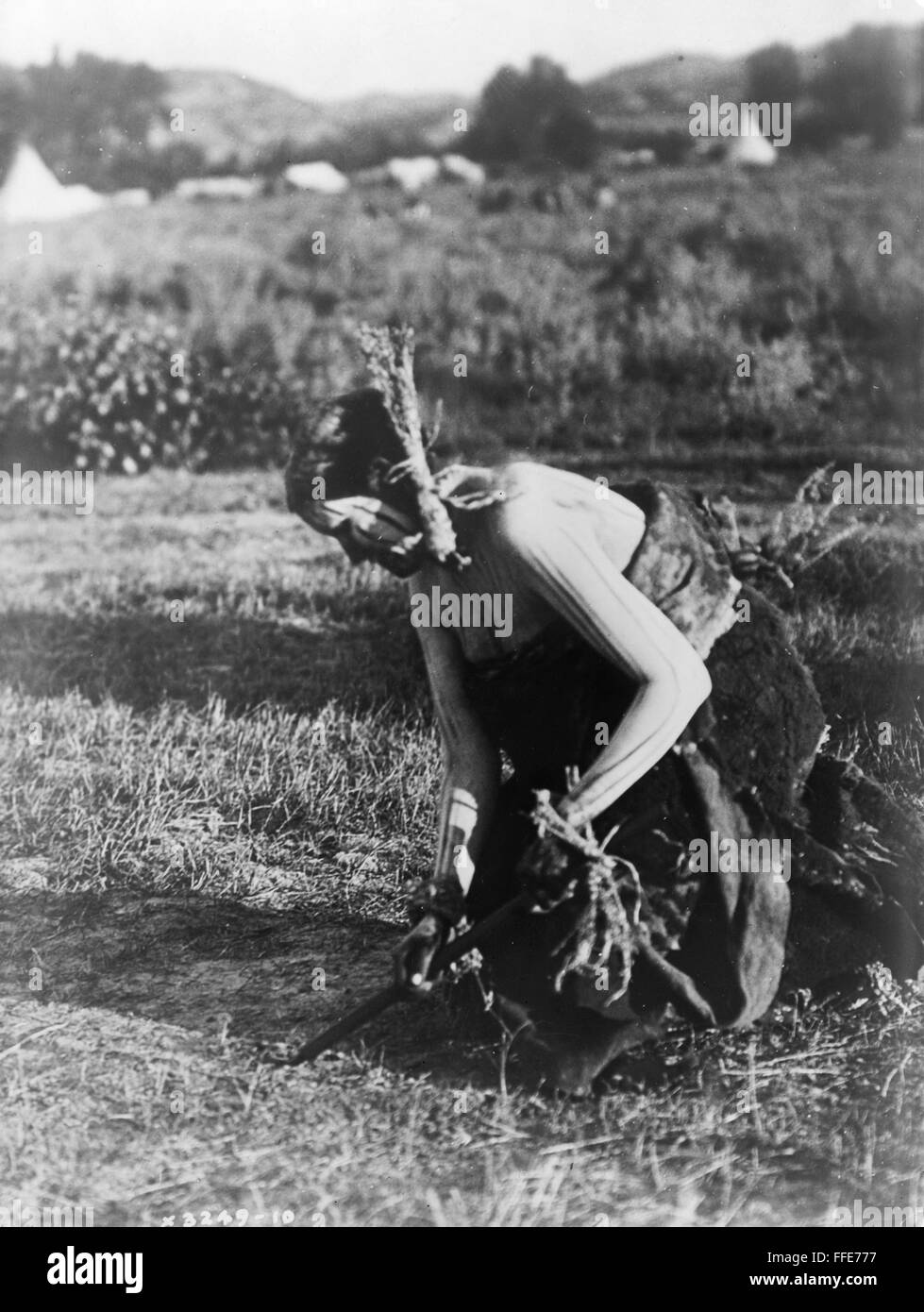 CHEYENNE SUN DANCE, c1910. /nA Cheyenne woman offering a pipe to the ...