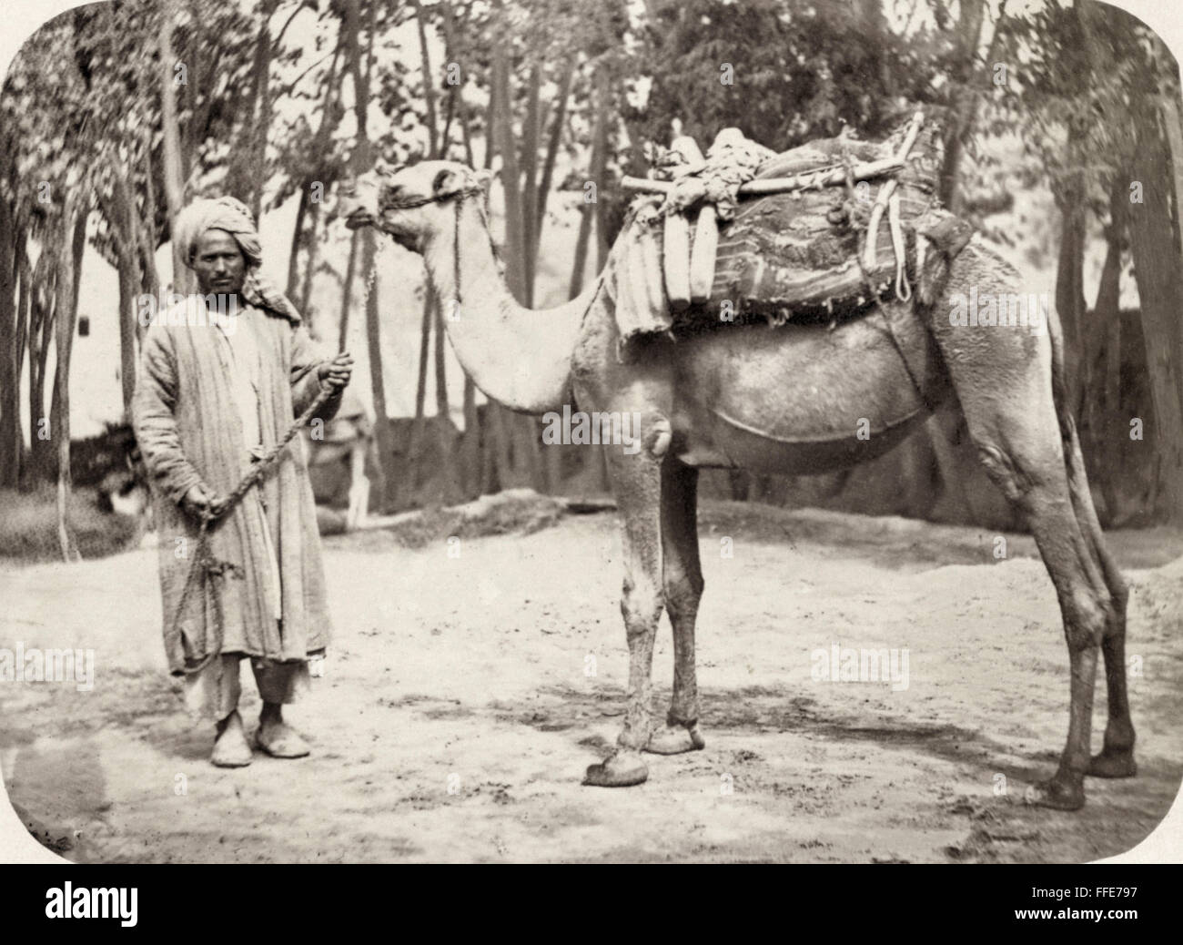 CENTRAL ASIAN TRAVELER. /nA Central Asian man with a camel wearing a ...
