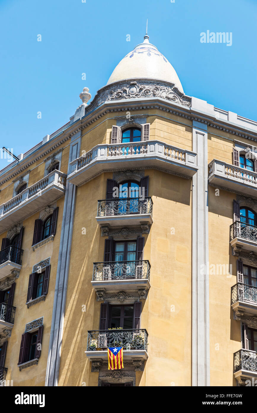 Facade of a classical building with the flag of the Estelada hanging ...