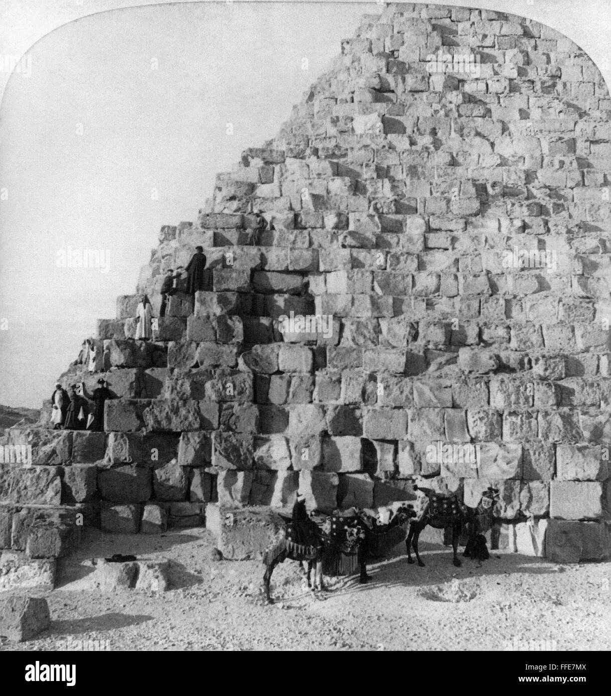 EGYPT: CHEOPS PYRAMID. /nGroup of tourists with guides on camels ...