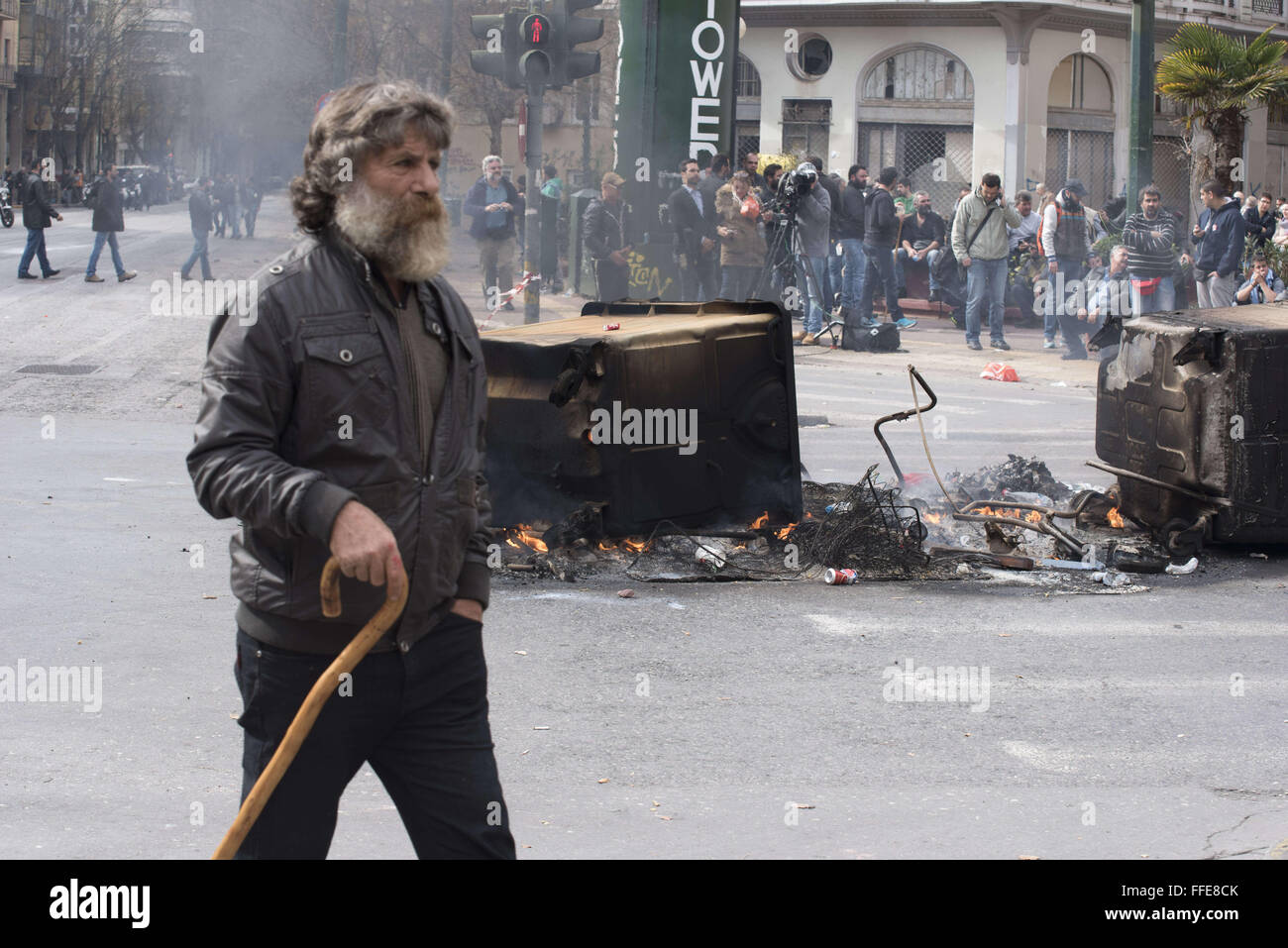 Athens, Greece. 12th Feb, 2016. Garbage bins burn after scuffles ...