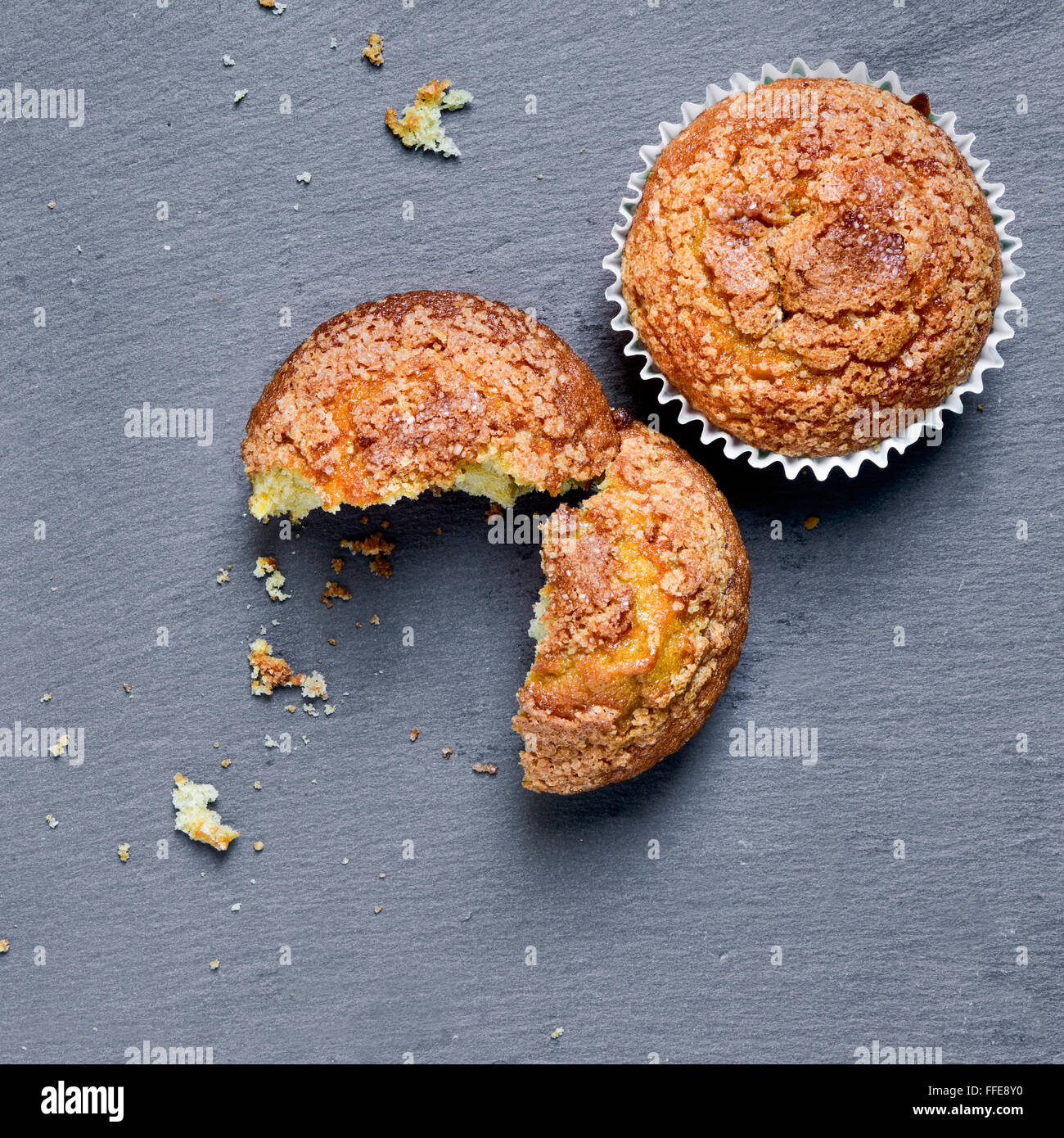 high-angle shot of some plain muffins on a slate background Stock Photo ...