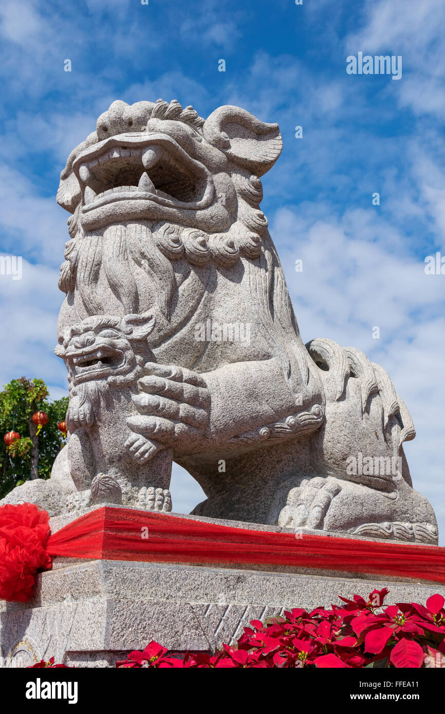 Stone lion statue in chinese temple Stock Photo - Alamy