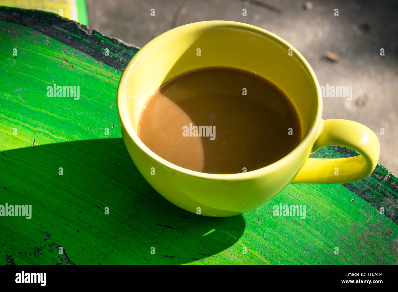 Close up coffee mug on the green table Stock Photo - Alamy