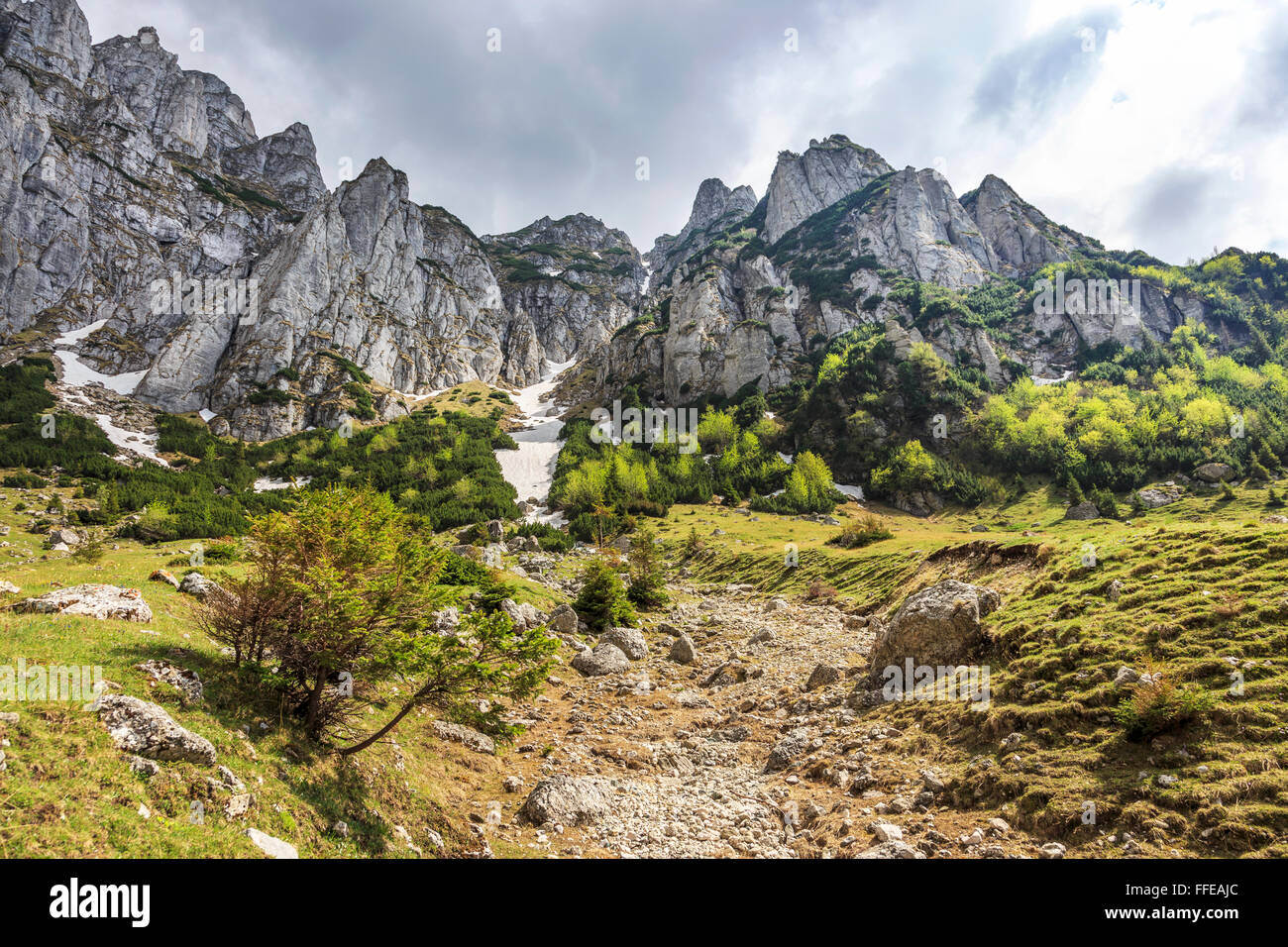 Sunny mountain landscape in spring from below Stock Photo - Alamy