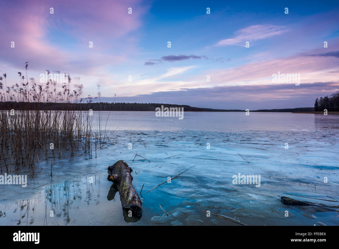 A sunset over icy lake Stock Photo - Alamy