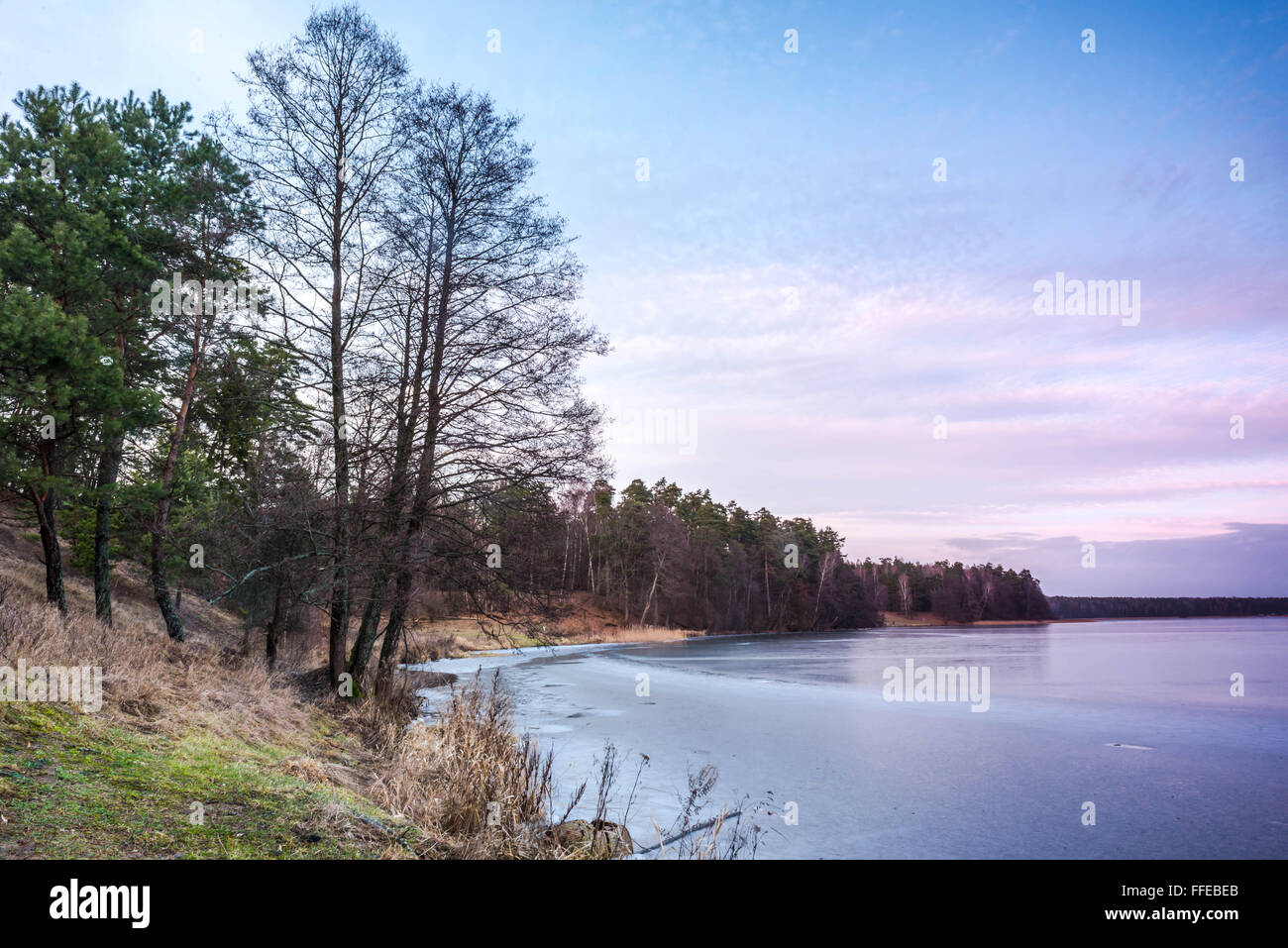 A sunset over icy lake Stock Photo - Alamy