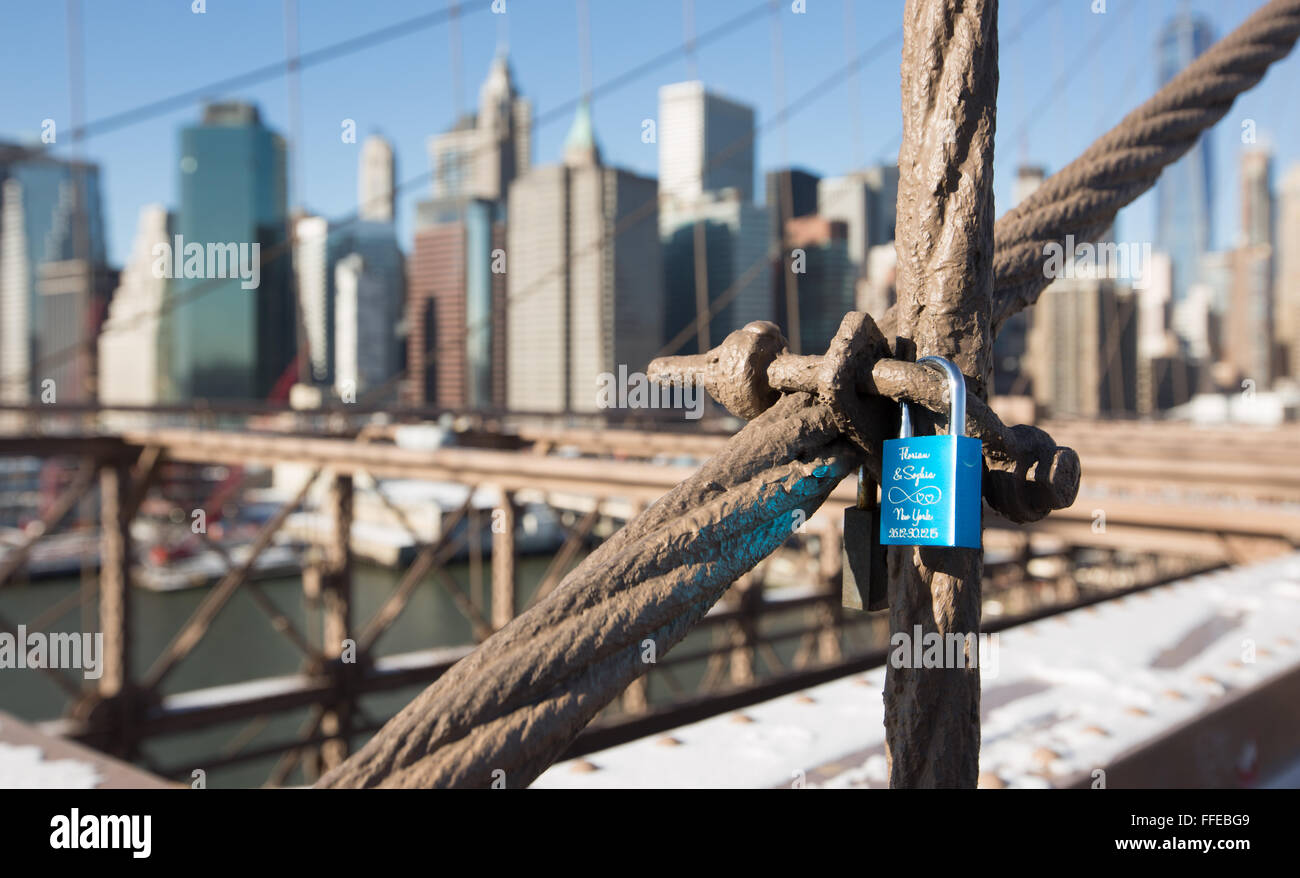 A single blue Love-lock hanging on Brooklyn Bridge NeW York City with ...