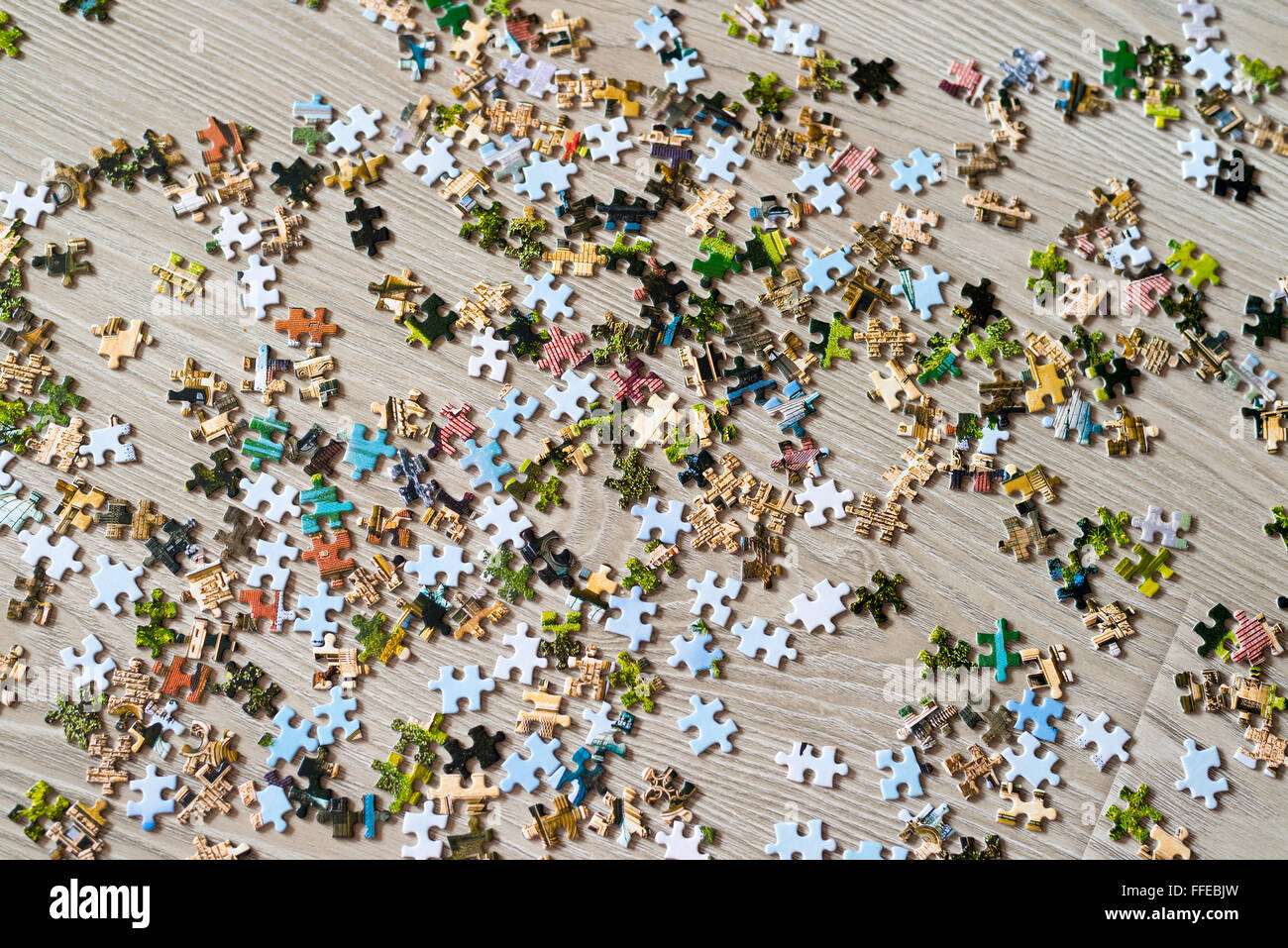 Picture collected from puzzles lies n floor Stock Photo - Alamy