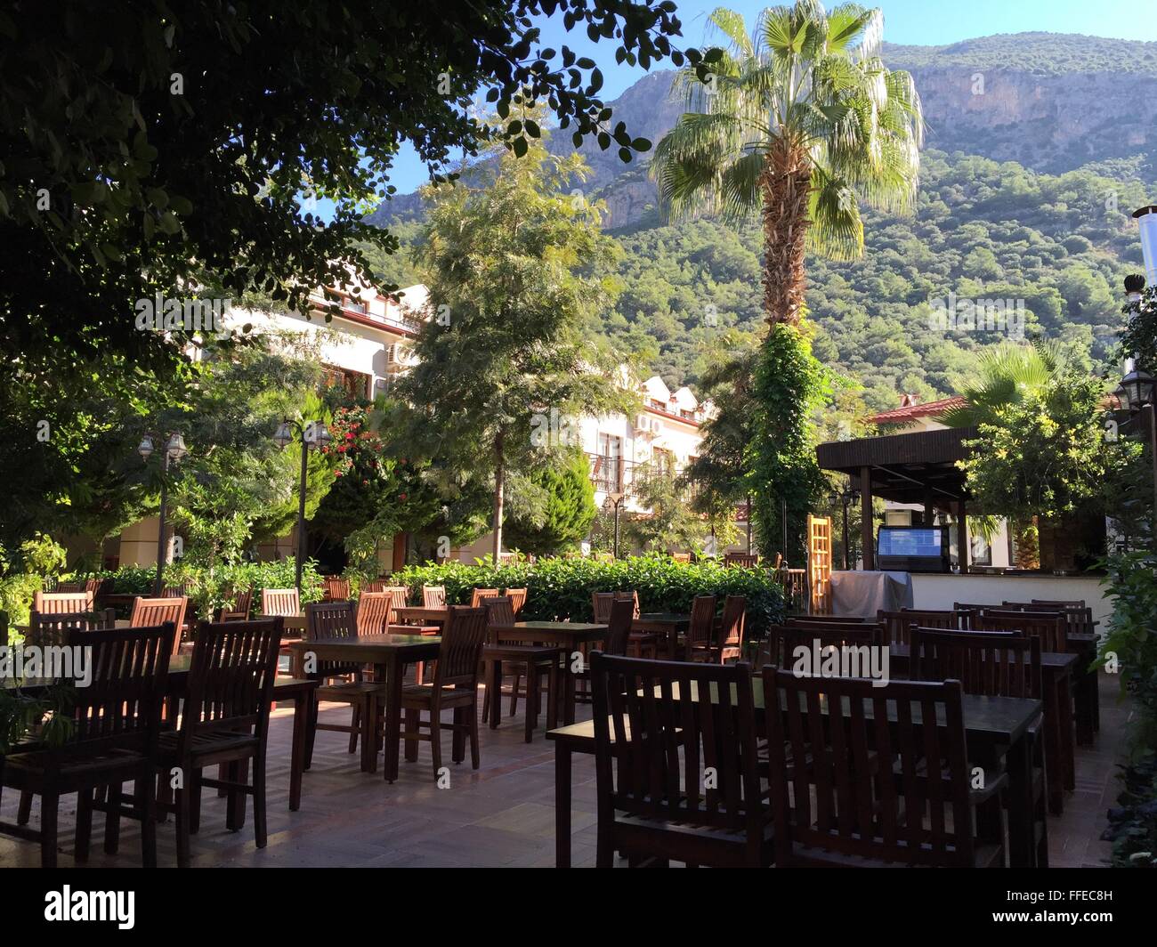 outdoor dining area overlooked by mountain and trees. holiday dining ...