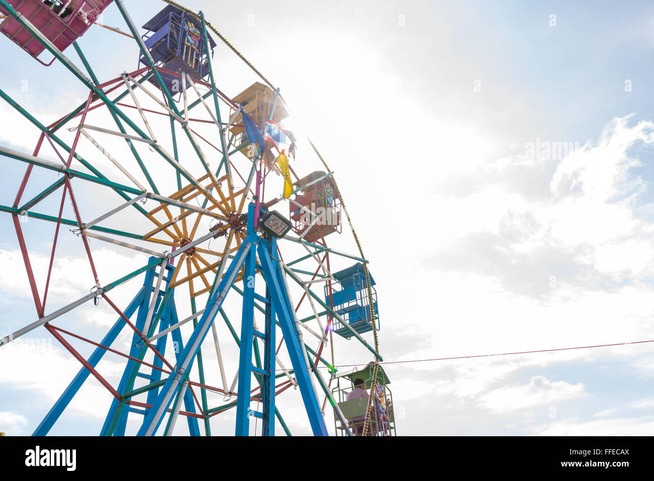 Ferris wheel in amusement park Stock Photo - Alamy