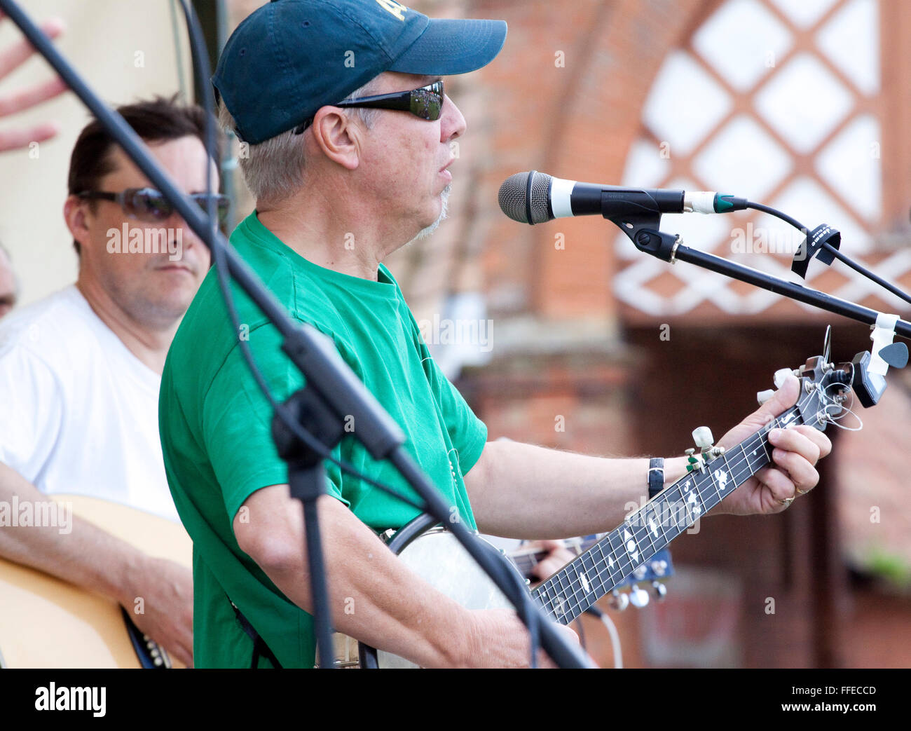 Playing banjo Tony Winn of band Songs from the Blue House, Shane Kirk ...
