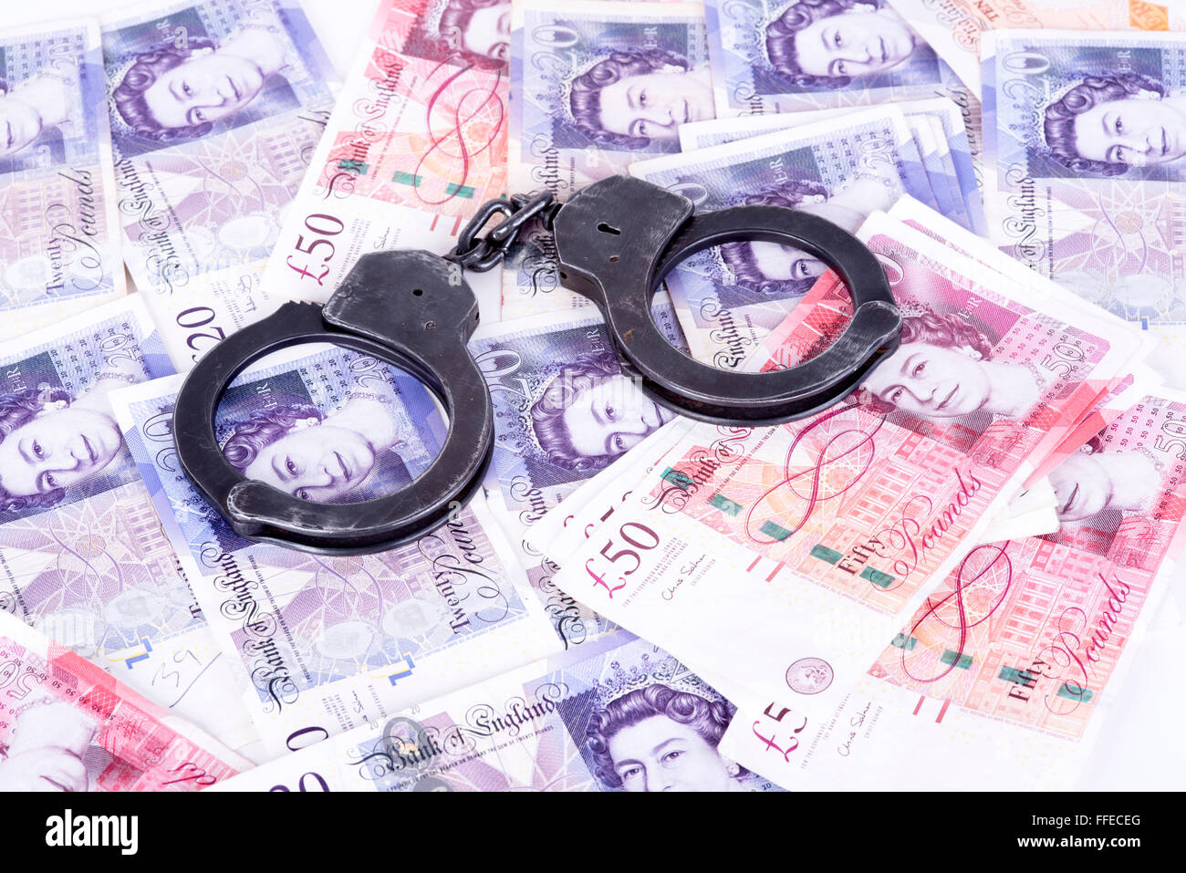 photo showing money with handcuffs Stock Photo - Alamy