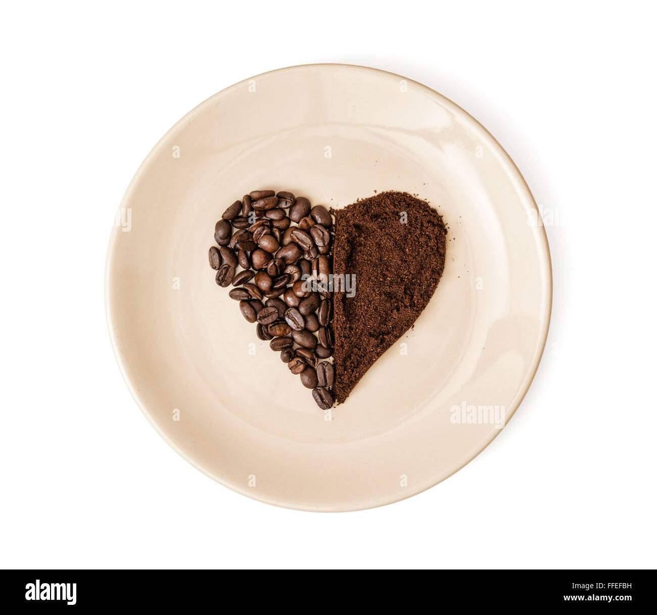 Heart made of coffee beans and ground coffee on the plate. Valentine's ...