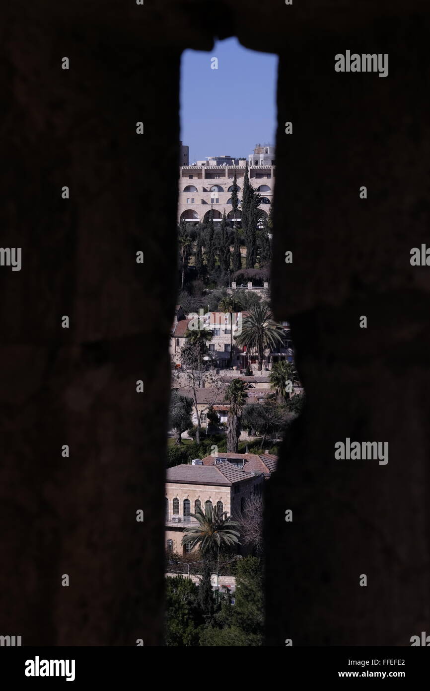 View through archers arrow loophole of old city wall toward Yemin Moshe ...