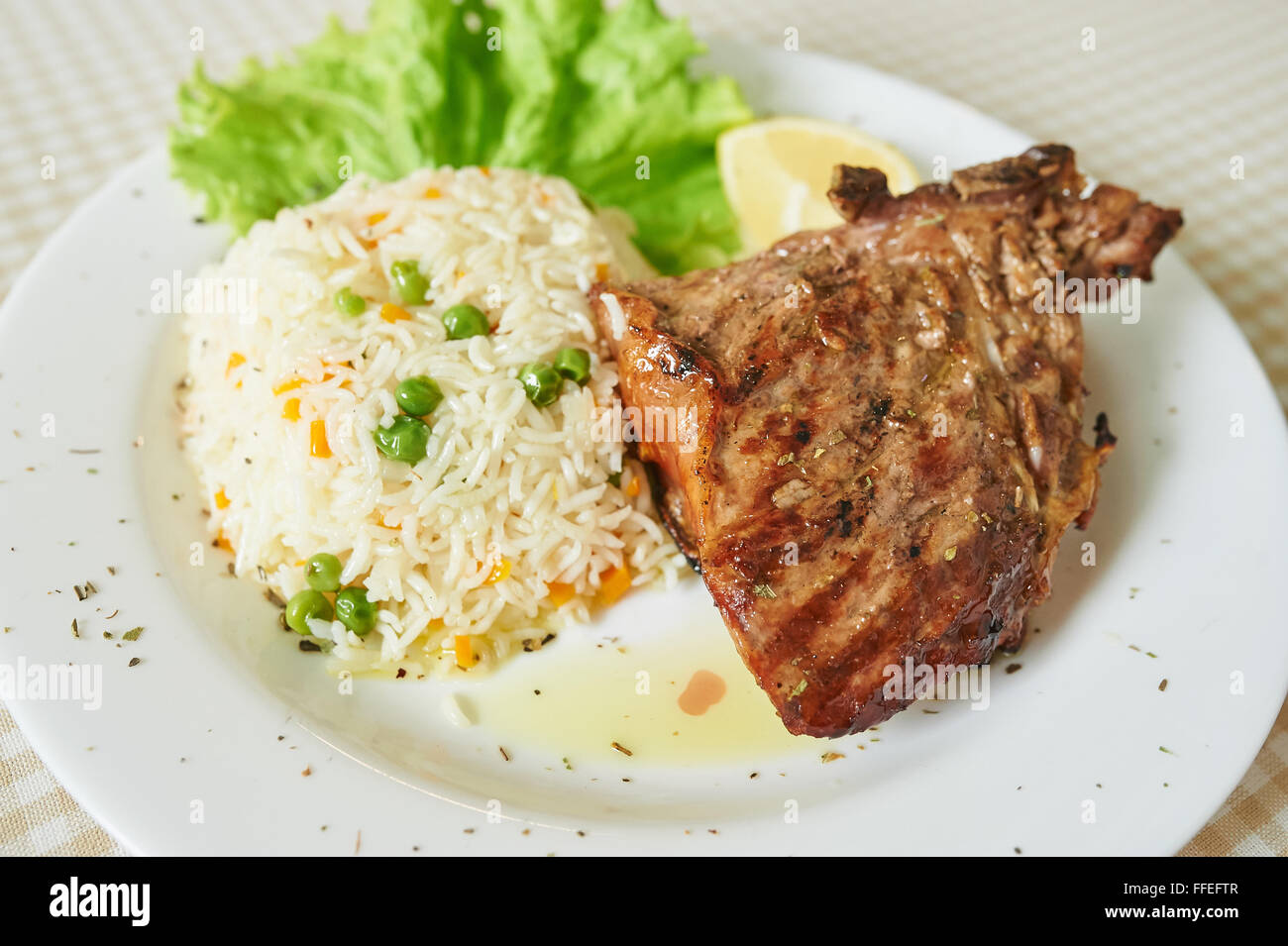 Chicken Steak with rice And Lettuce on white plate Stock Photo - Alamy