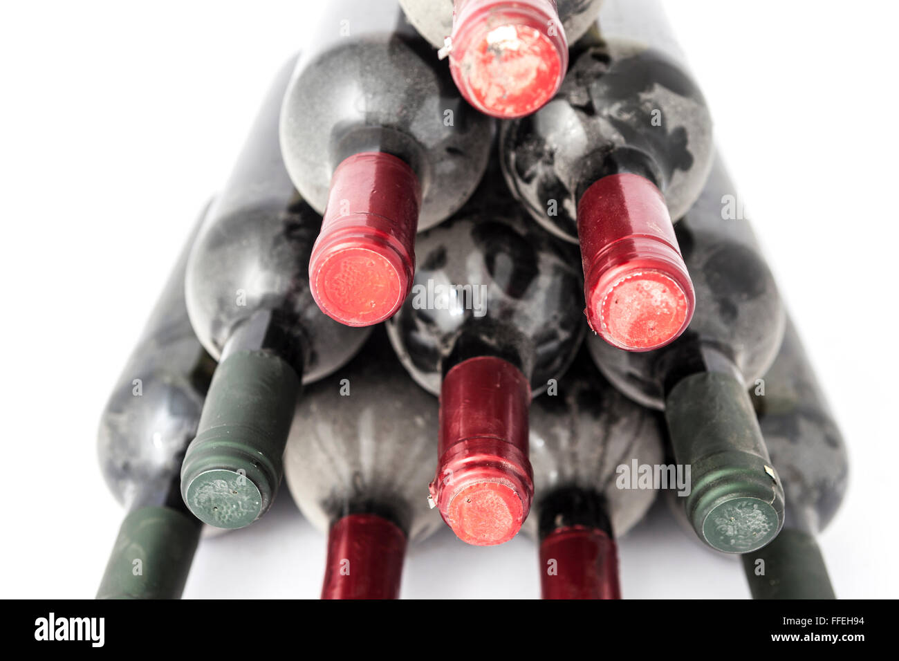 Old dusty wine bottles on white background Stock Photo - Alamy