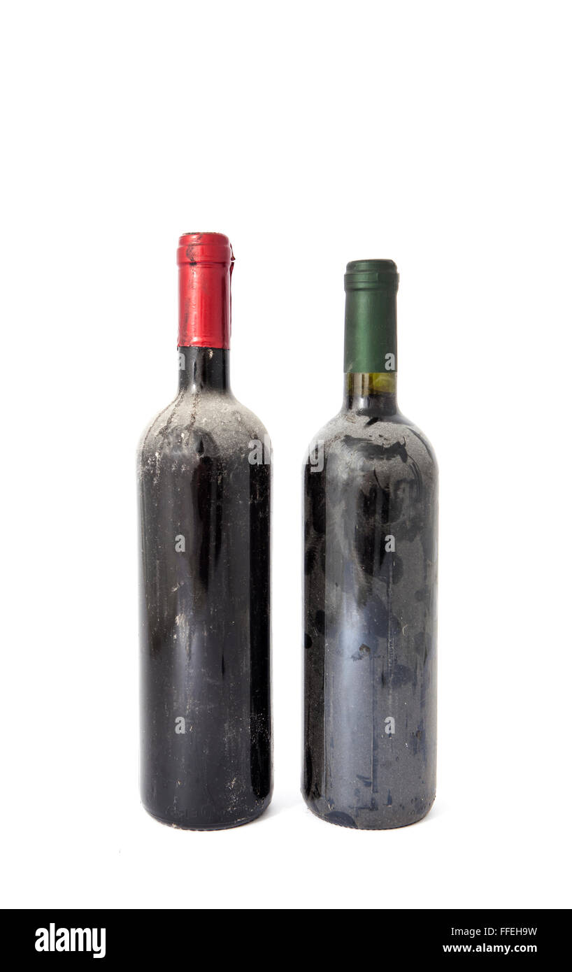 Old dusty wine bottles on white background Stock Photo - Alamy