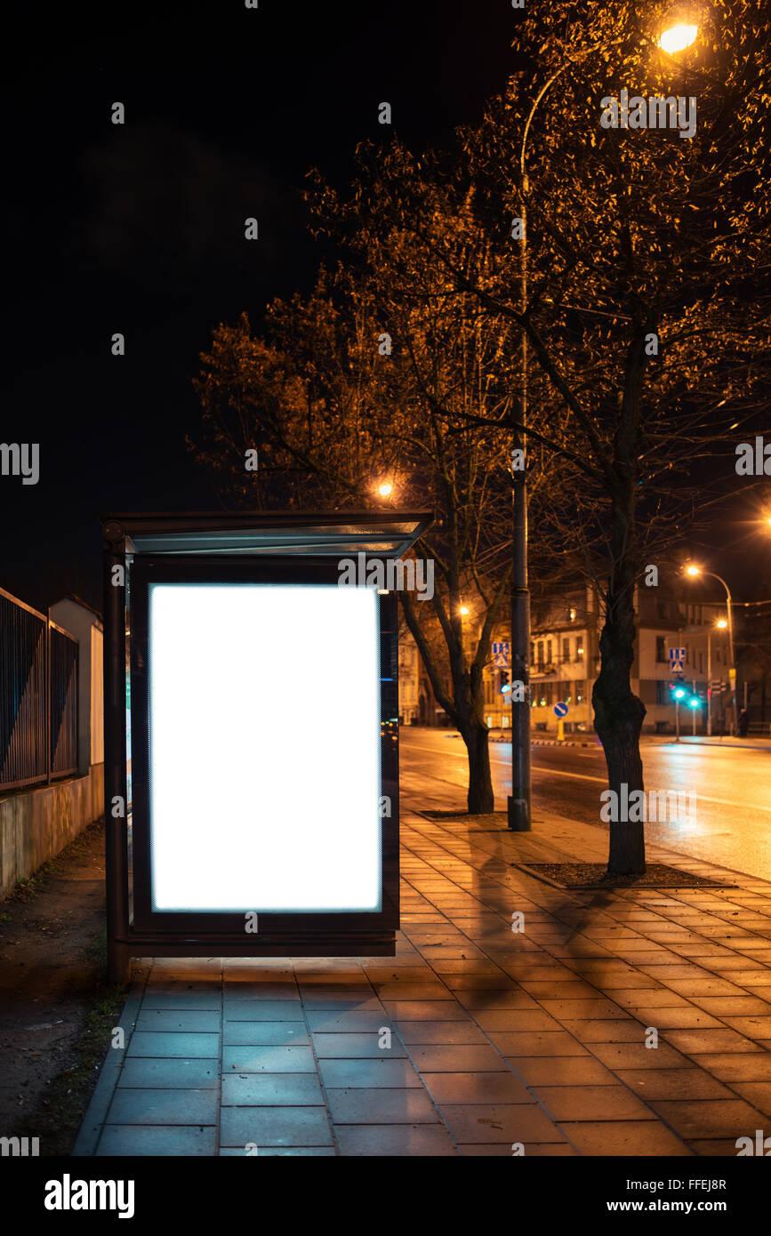 Blank bus stop advertising billboard in the city at night Stock Photo ...