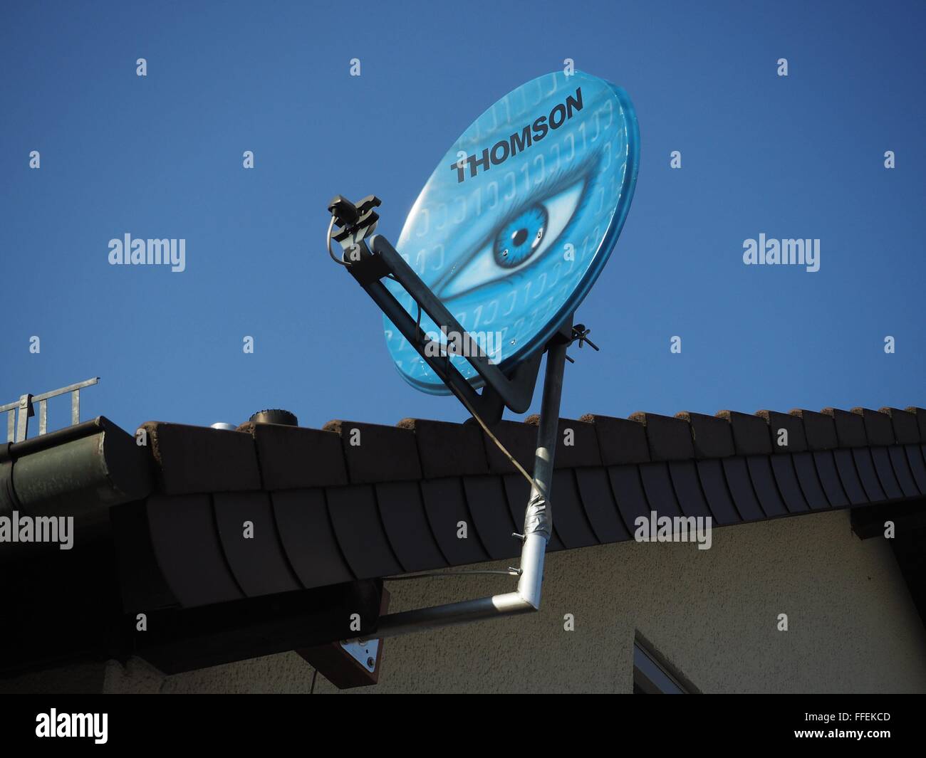 An eye is seen on a satellite dish on a private home in Berlin on ...