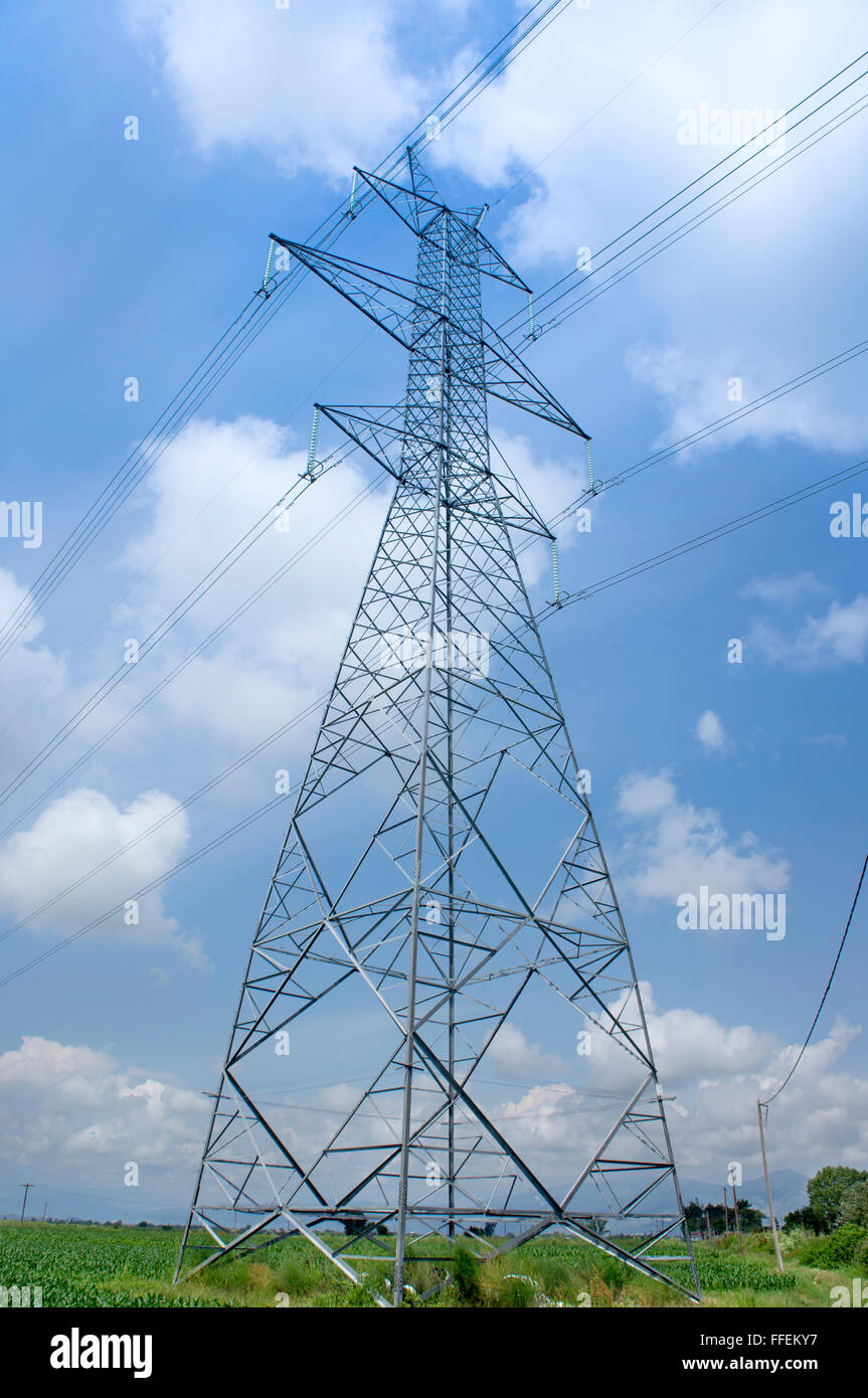 Electricity Pylons crossing along a green field in Alexadroupolis ...
