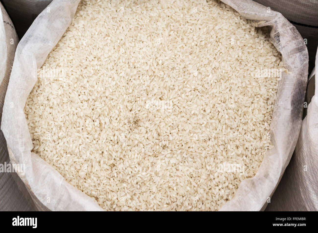 Bag of raw rice on open market Stock Photo - Alamy