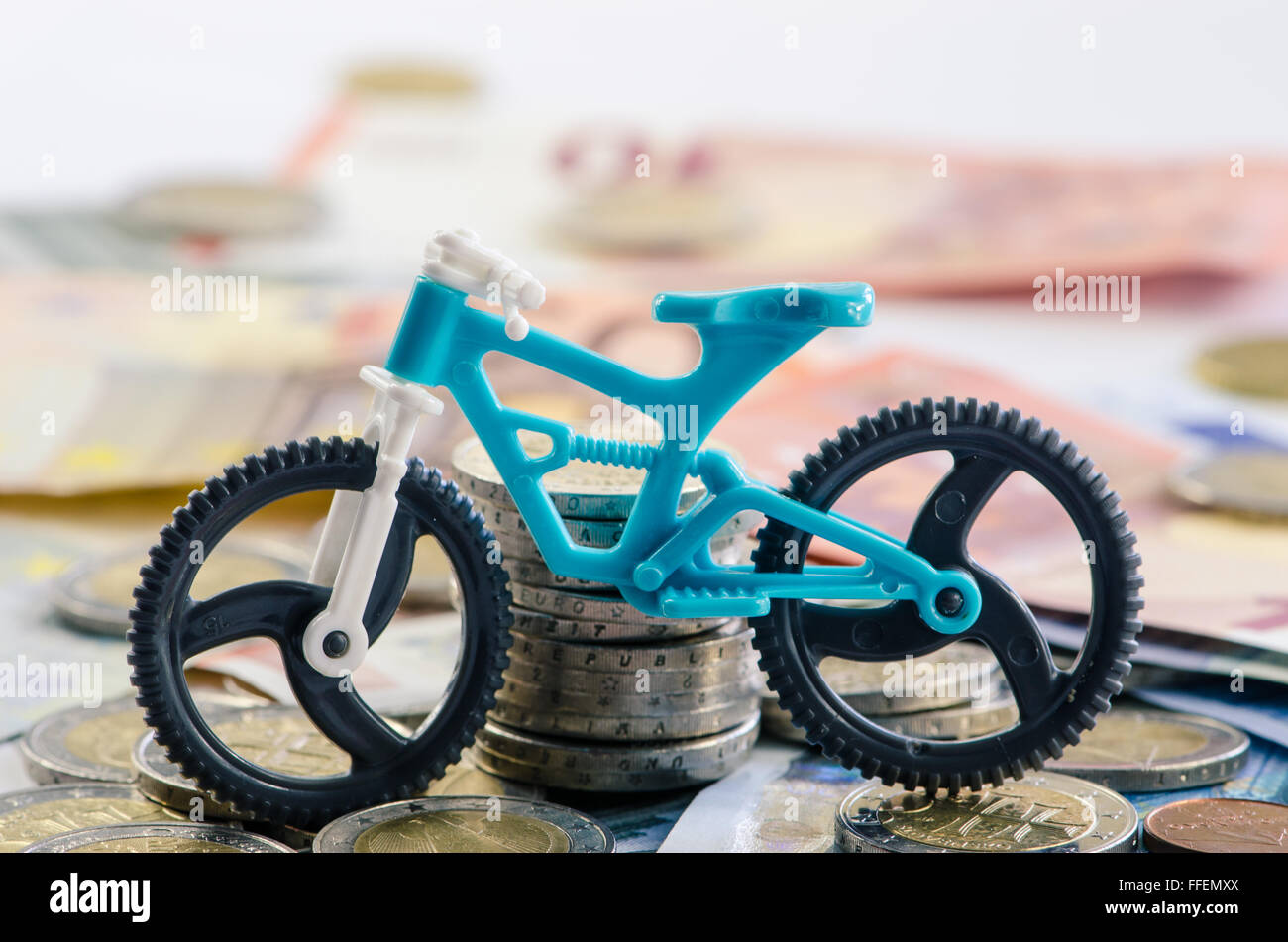 toy bicycle, banknotes and coins Stock Photo - Alamy