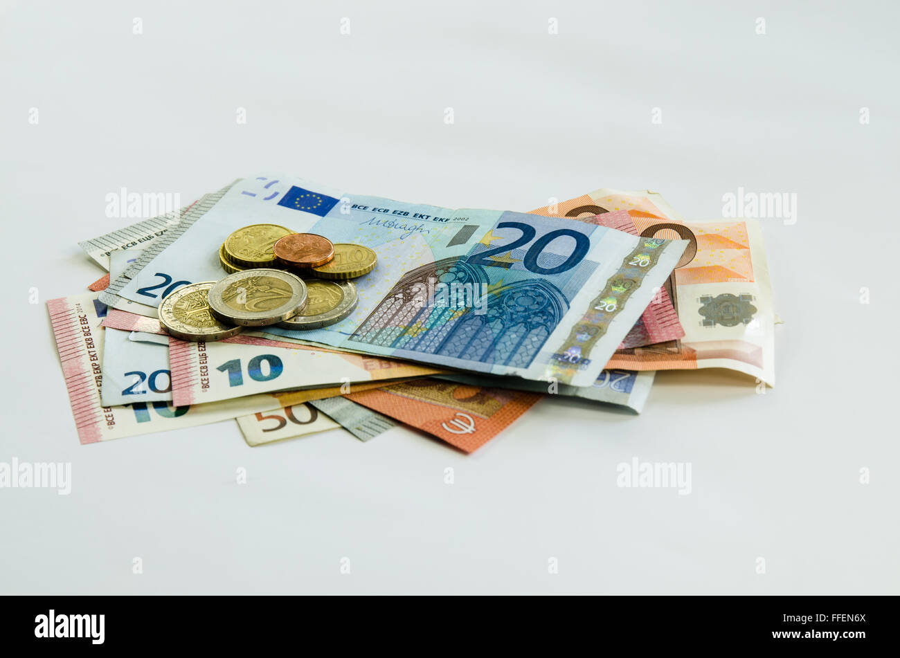 euro banknotes with different denomination and coins Stock Photo - Alamy