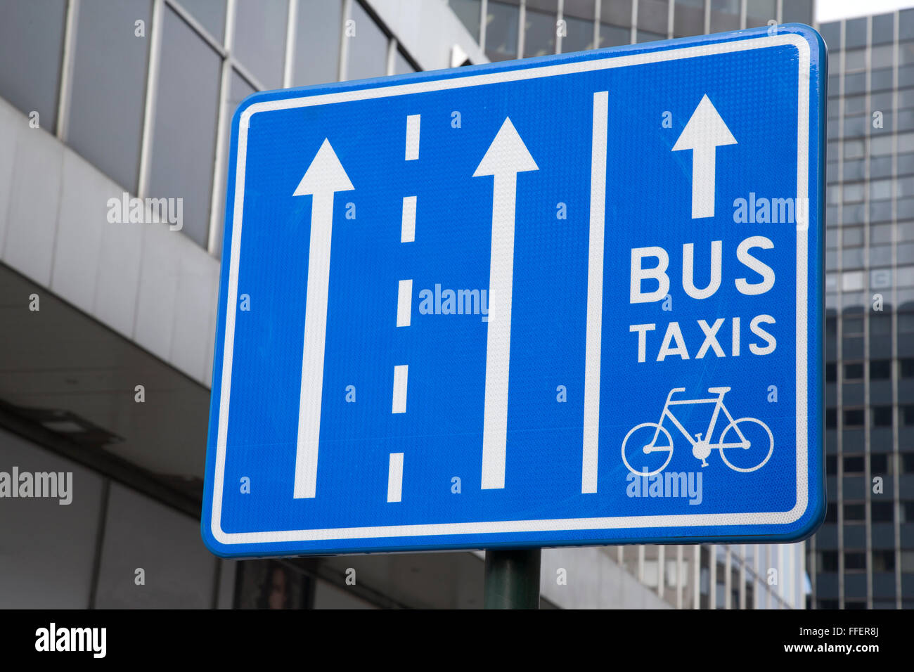 Blue Bus, Taxi and Bicycle Traffic Sign in Urban Setting Stock Photo ...