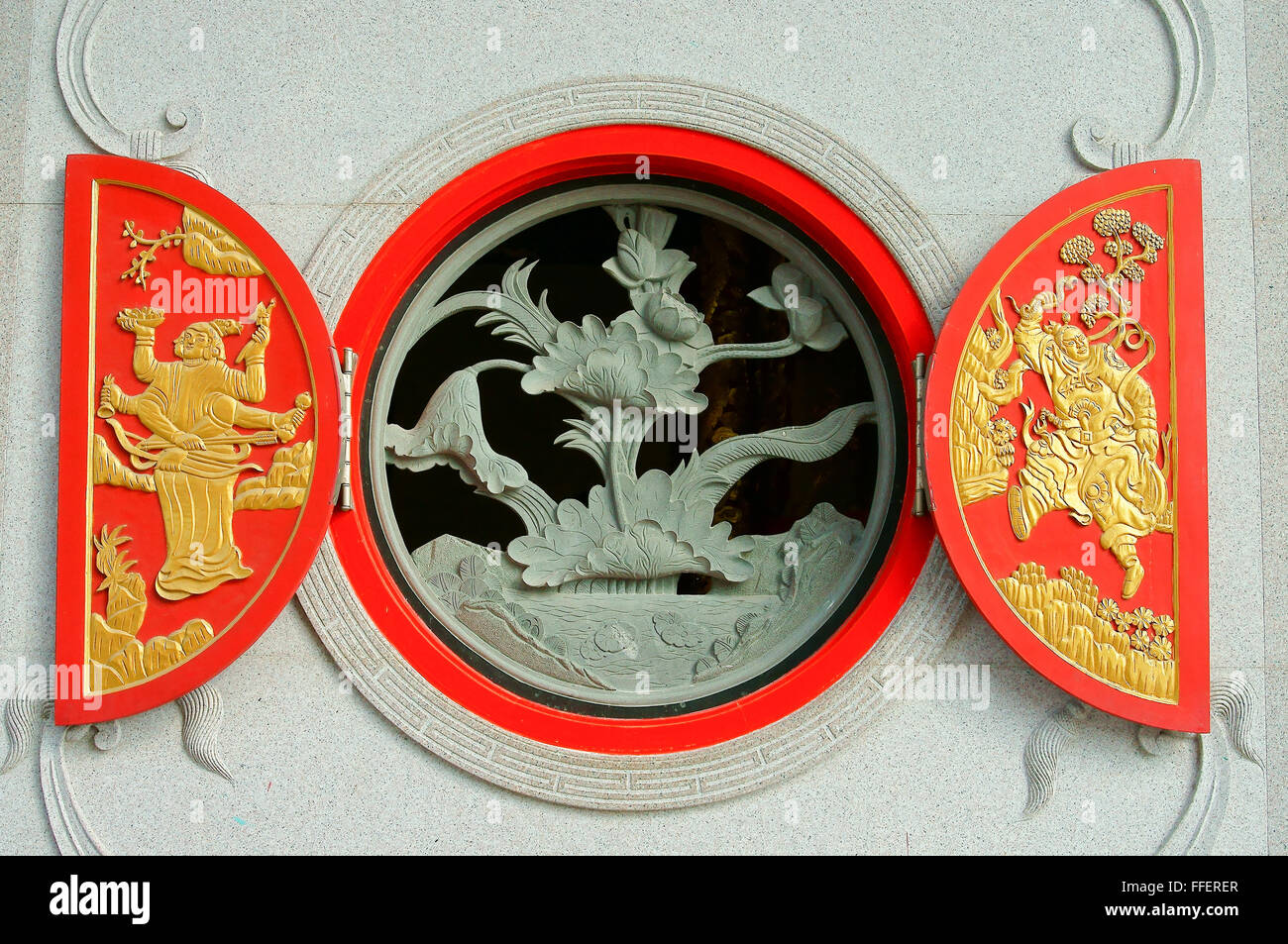 Chinese circular window decorated with stone sculpture Stock Photo - Alamy