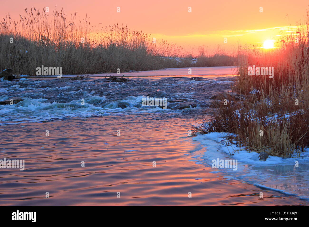 Dawn over Rushing winter river Stock Photo - Alamy