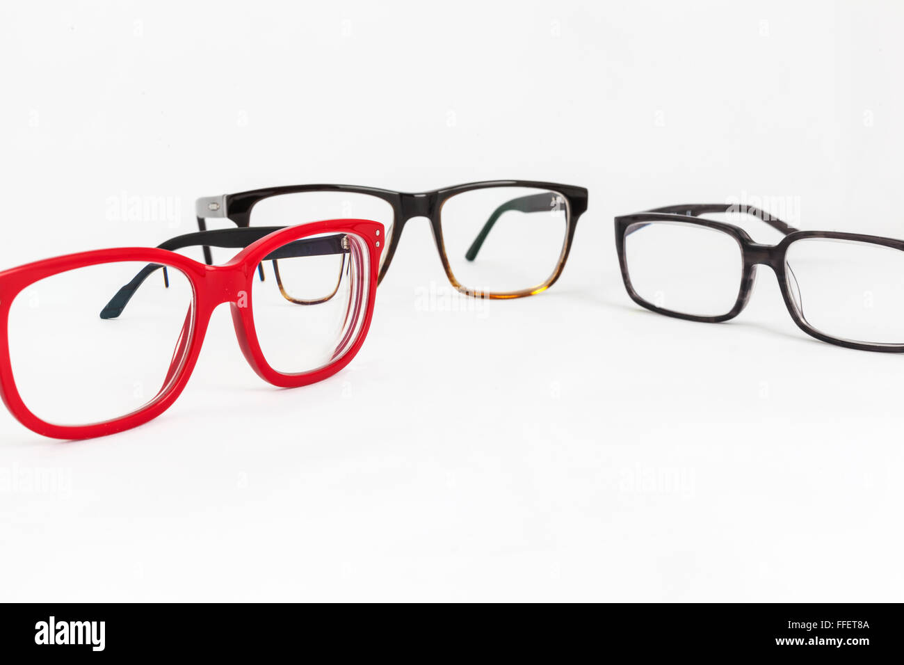 many red and black eyeglasses with white background Stock Photo - Alamy
