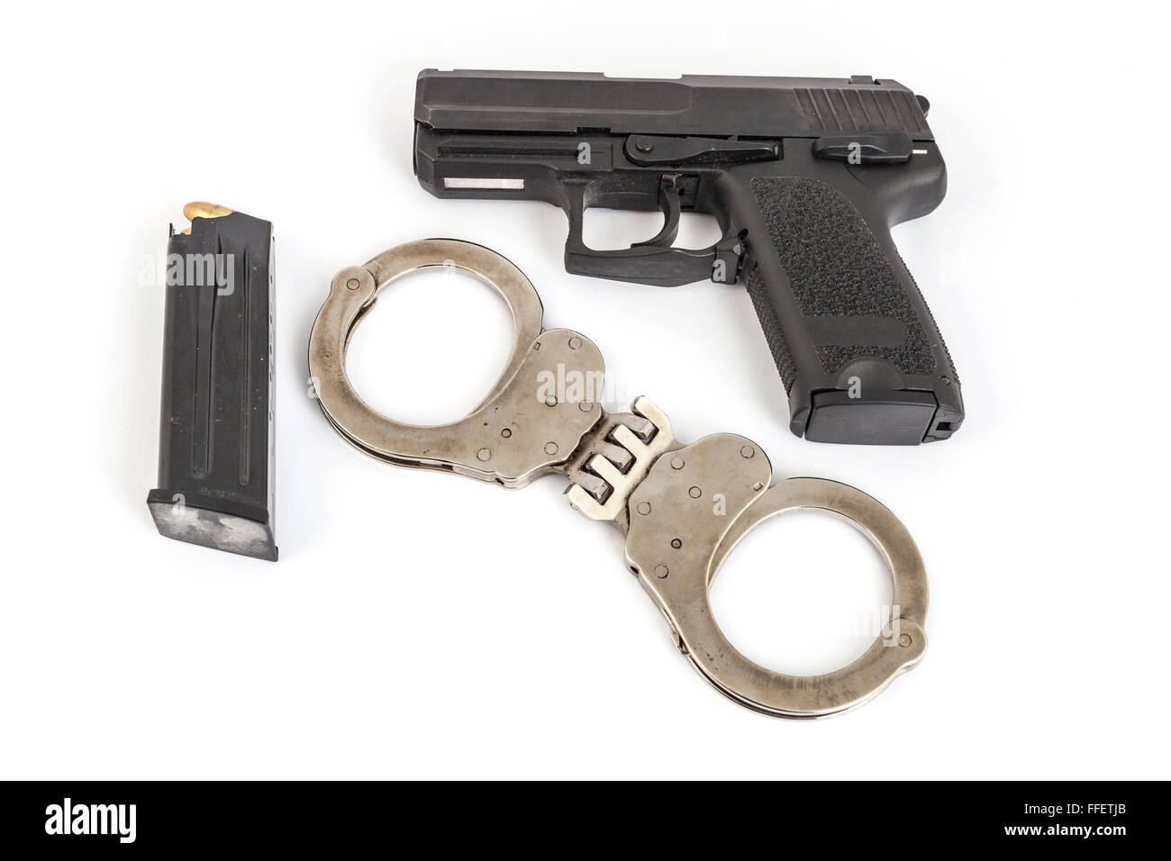 gun and handcuffs with white background Stock Photo - Alamy